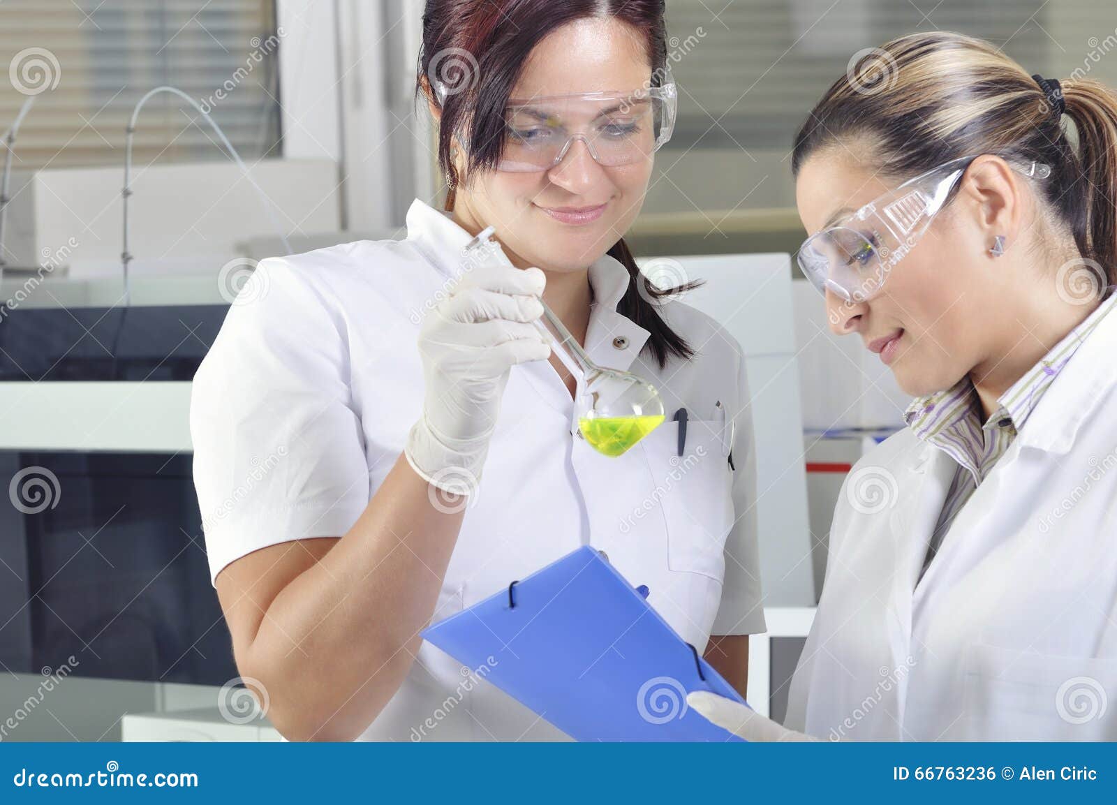 Two Scientists Observing Something With Microscope Stock Photo ...