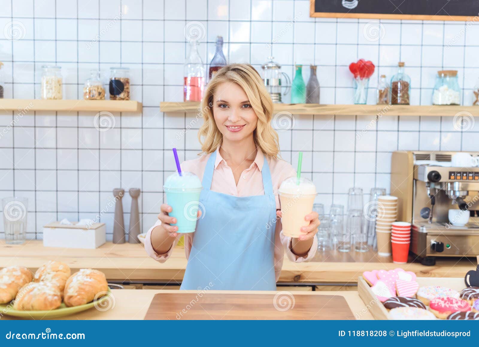 Attractive Young Waitress Holding Milkshakes in Plastic Cups and ...