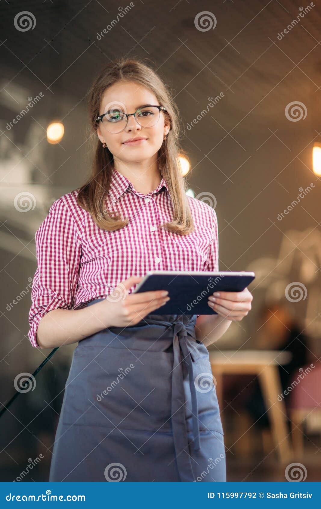Attractive Young Waitress Using a Tablet Computer Stock Photo - Image ...