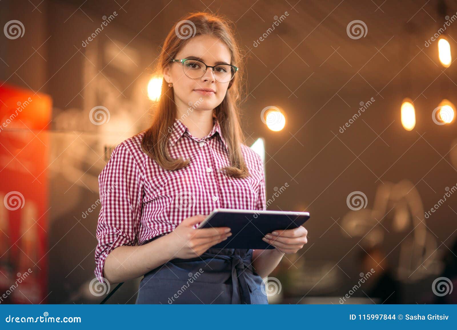 Attractive Young Waitress Using a Tablet Computer Stock Photo - Image ...