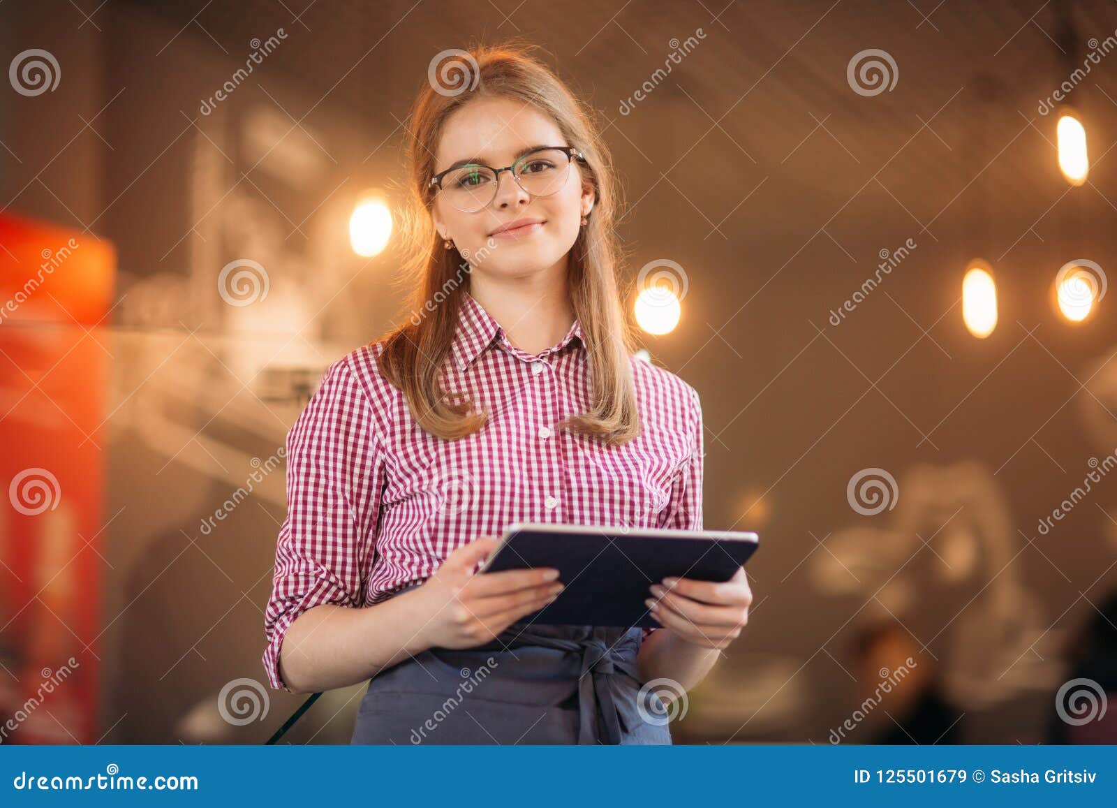Attractive Young Waitress Using a Tablet Computer Stock Image - Image ...