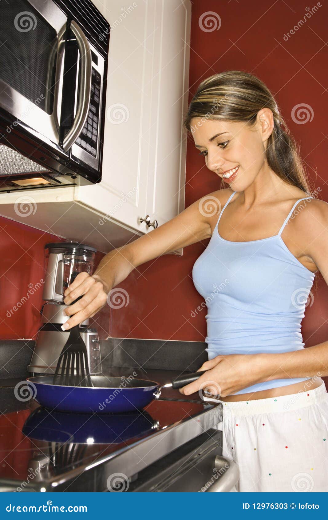 Attractive Young Woman in Kitchen Cooking Stock Image - Image of casual ...