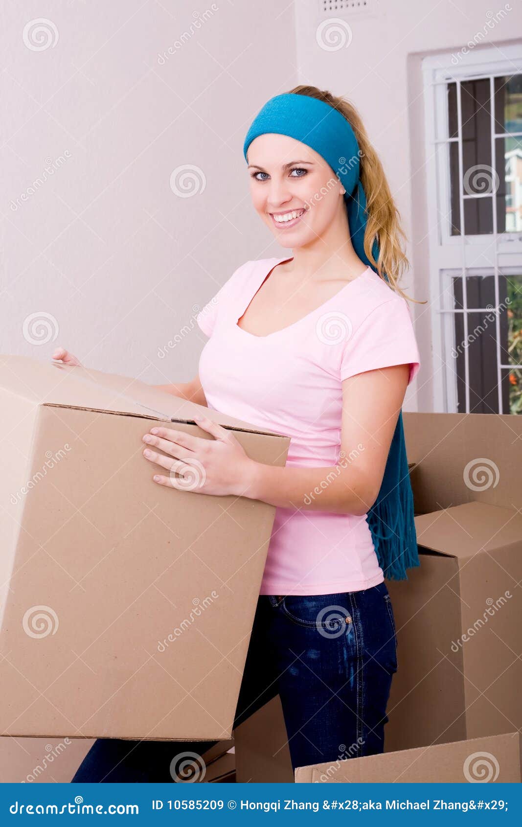 Attractive Young Woman Moving House Stock Image - Image of relocating ...