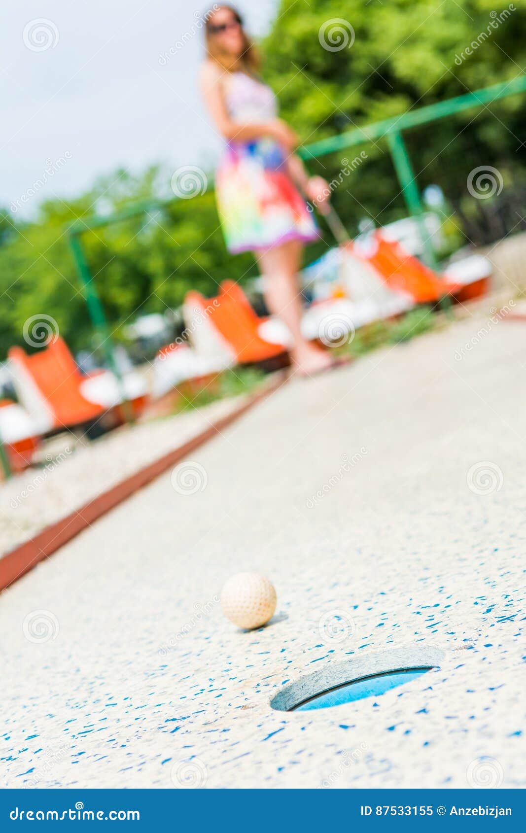 Attractive Young Woman Playing Mini Golf. Stock Image - Image of stick ...