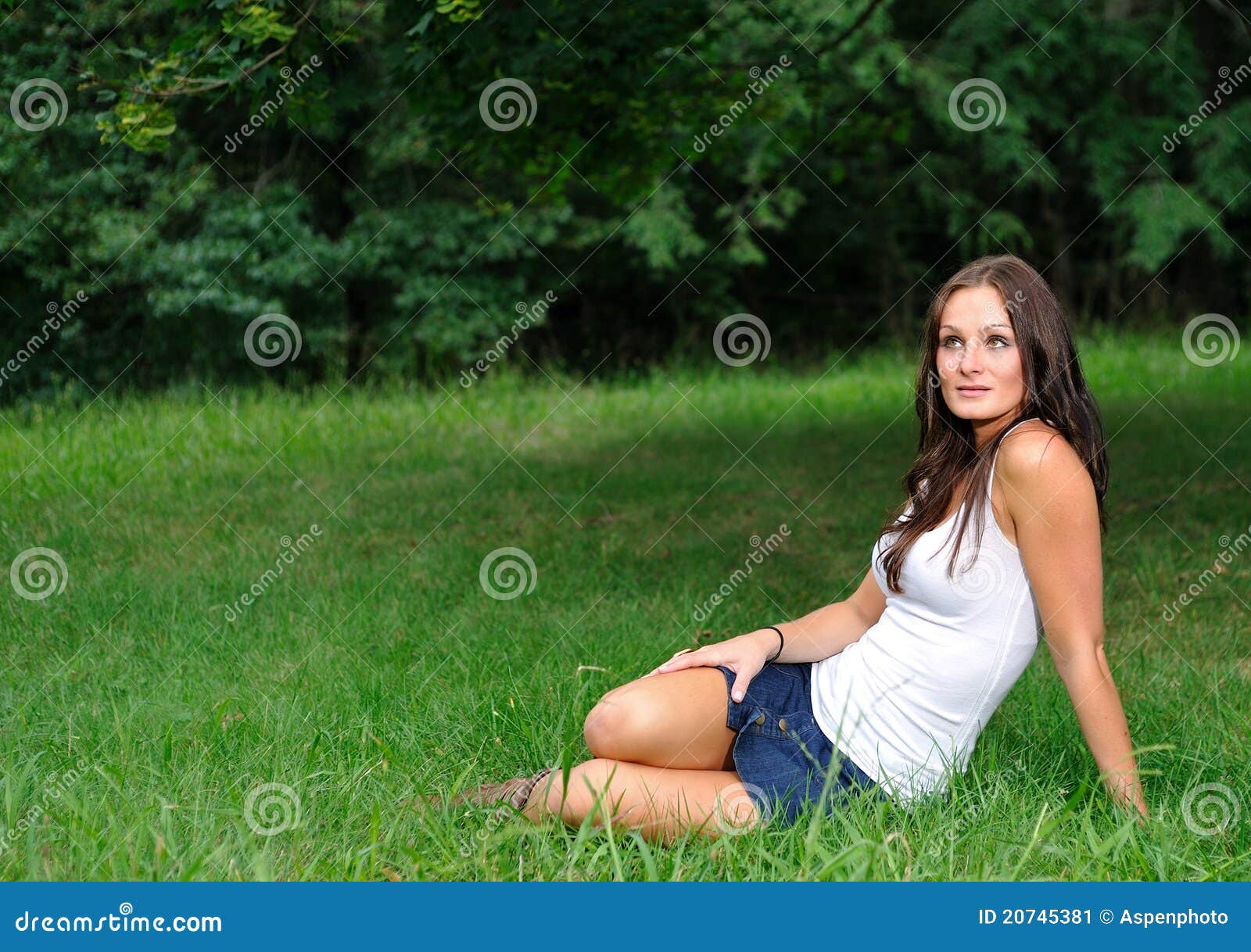 Attractive Young Woman Sitting in Field Stock Image - Image of seated ...