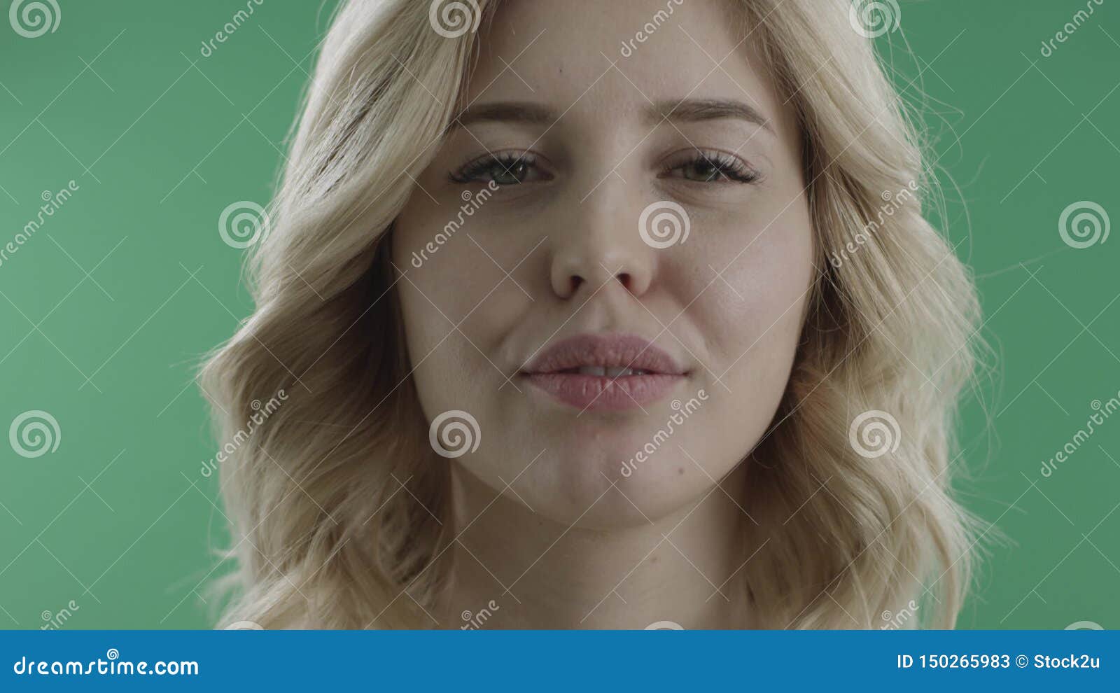 Attractive Young Woman Smiles Against Green Screen Stock Video Video