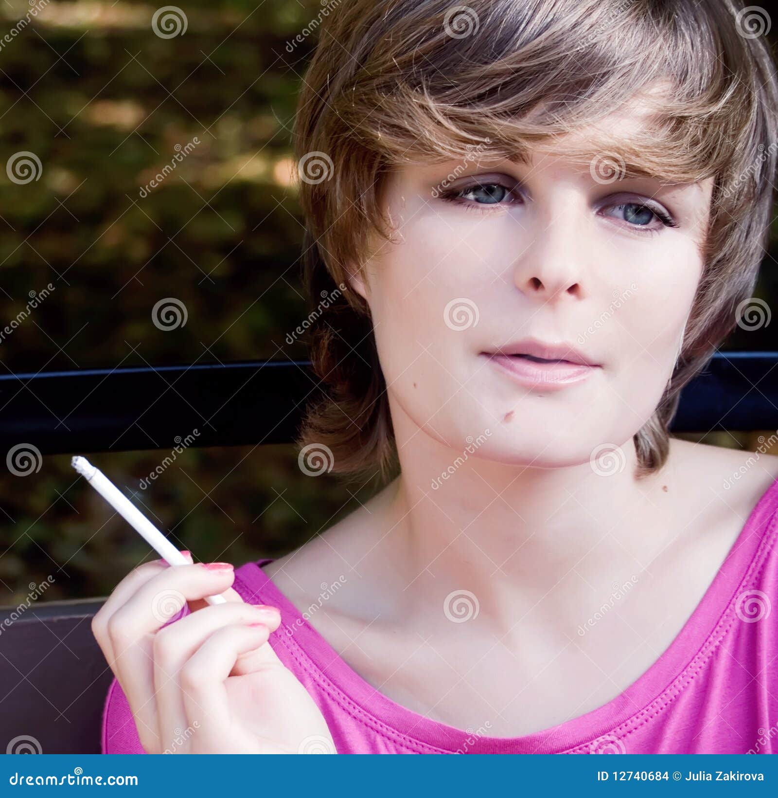 Attractive Young Woman Smoking Stock Photo - Image of grey, pink: 12740684