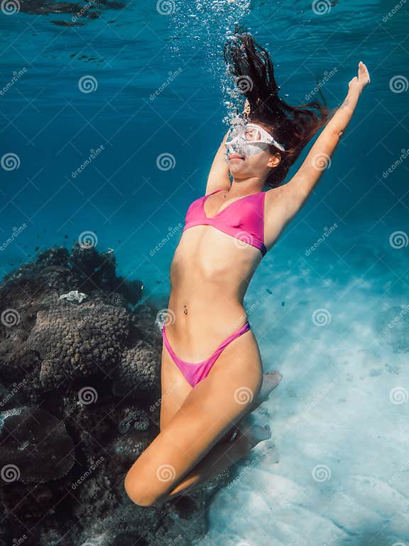 Attractive Woman Swims Underwater In The Sea Woman With Sporty Body