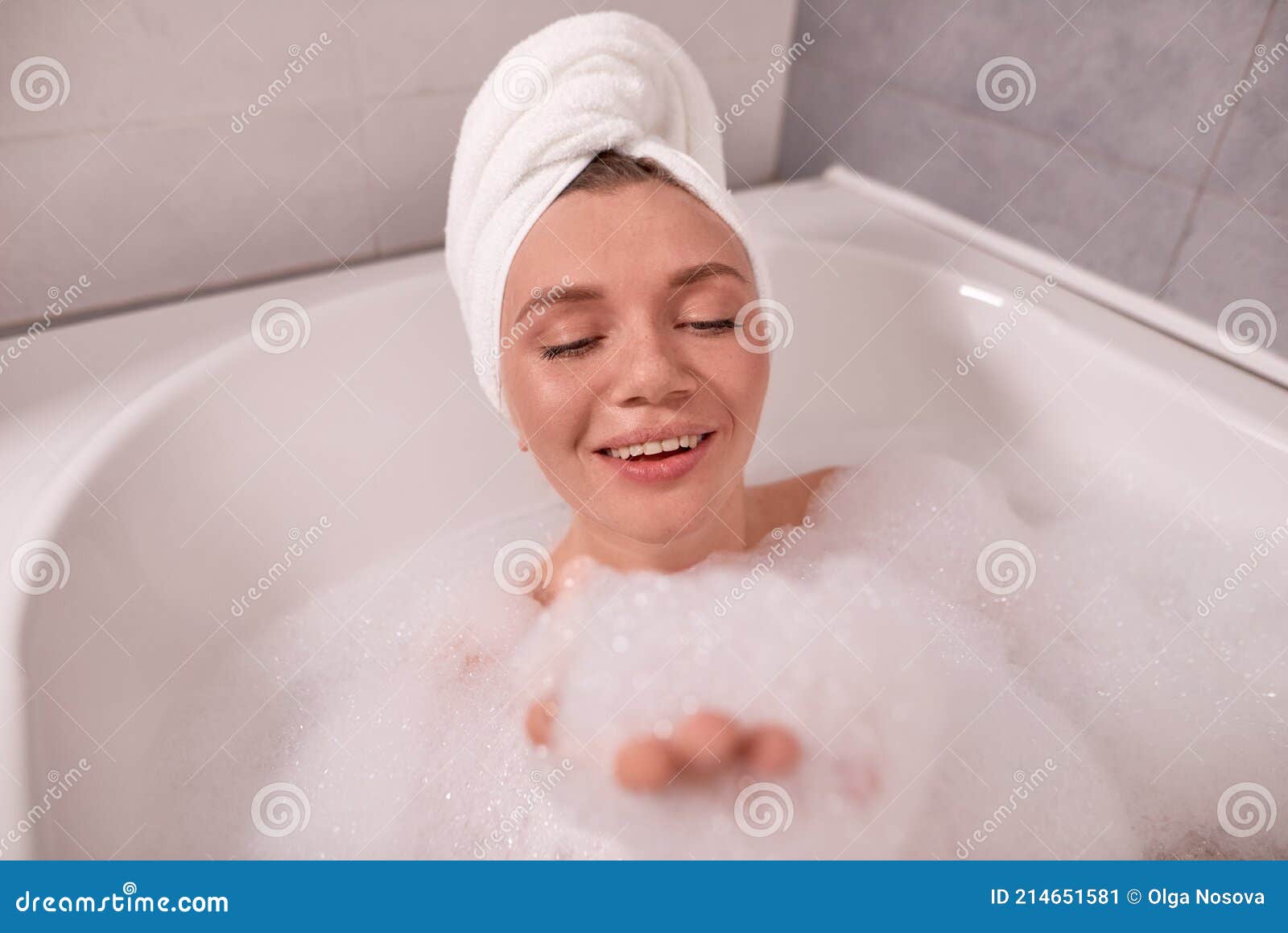 Attractive Woman Taking Bath With Foam Female With Towel On Head