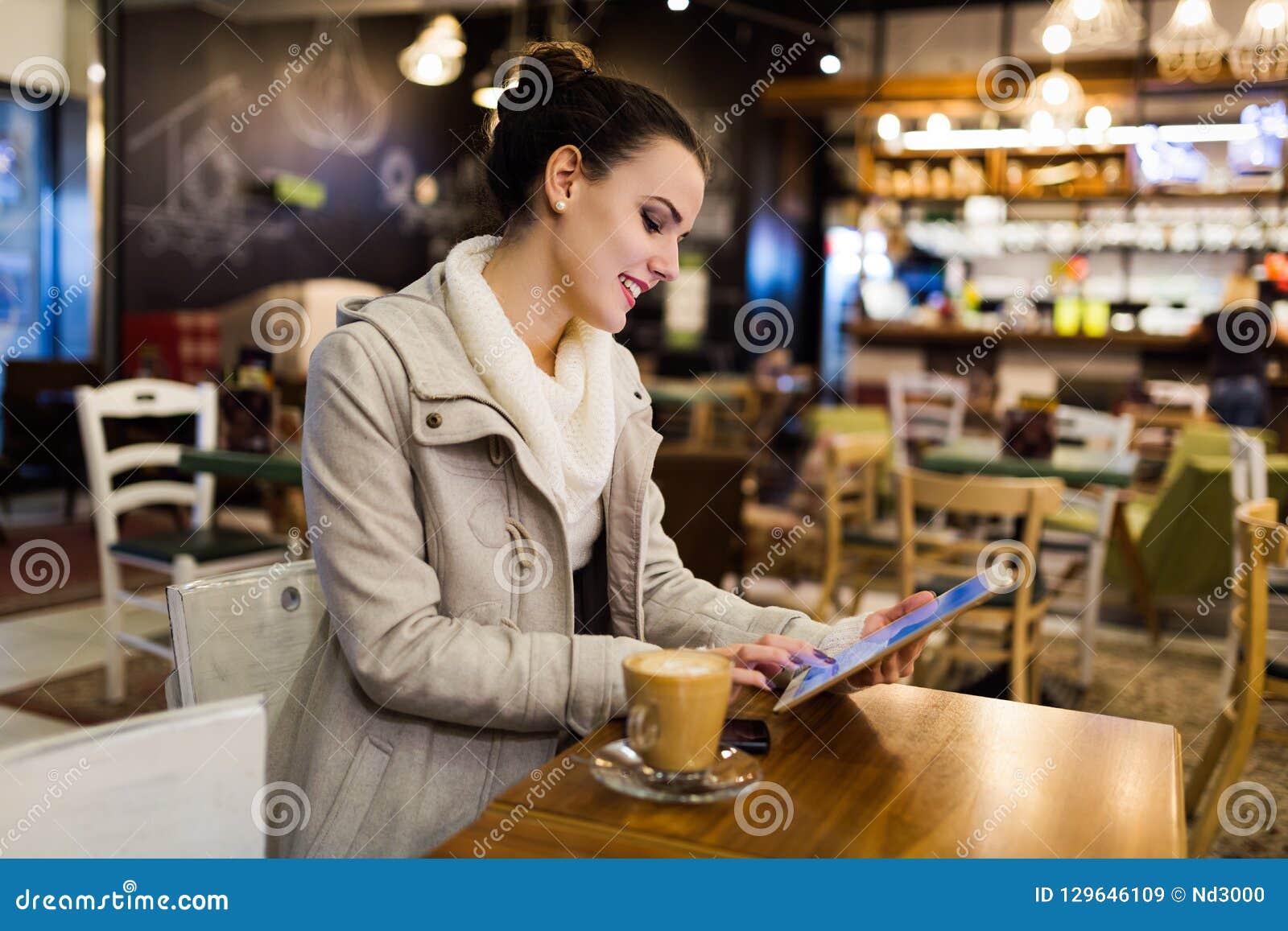 Attractive Young Woman Using Tablet in Cafe Stock Image - Image of ... Attractive Young Woman Using Tablet in Cafe Stock Image - Image of ...