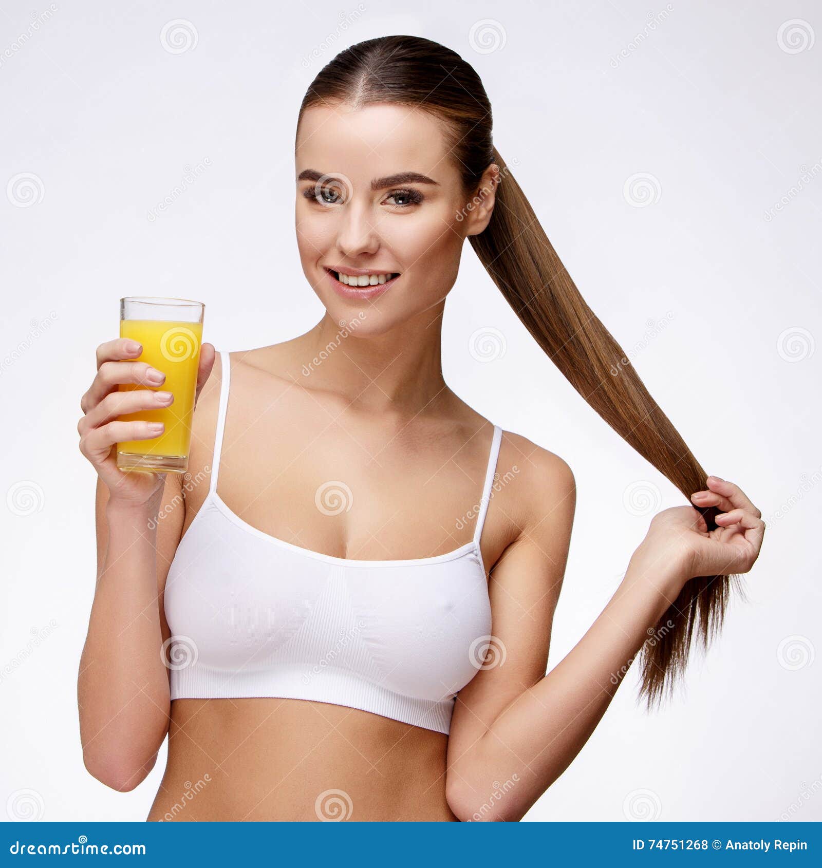 Attractivesmiling Woman Holding Glass Of Orange Juice Isolated On White