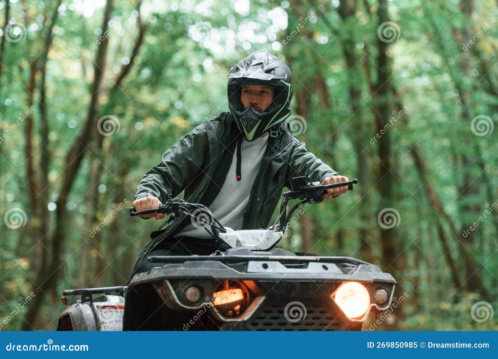ATV Driver is in the Forest, Having a Ride at Daytime Stock Image ...