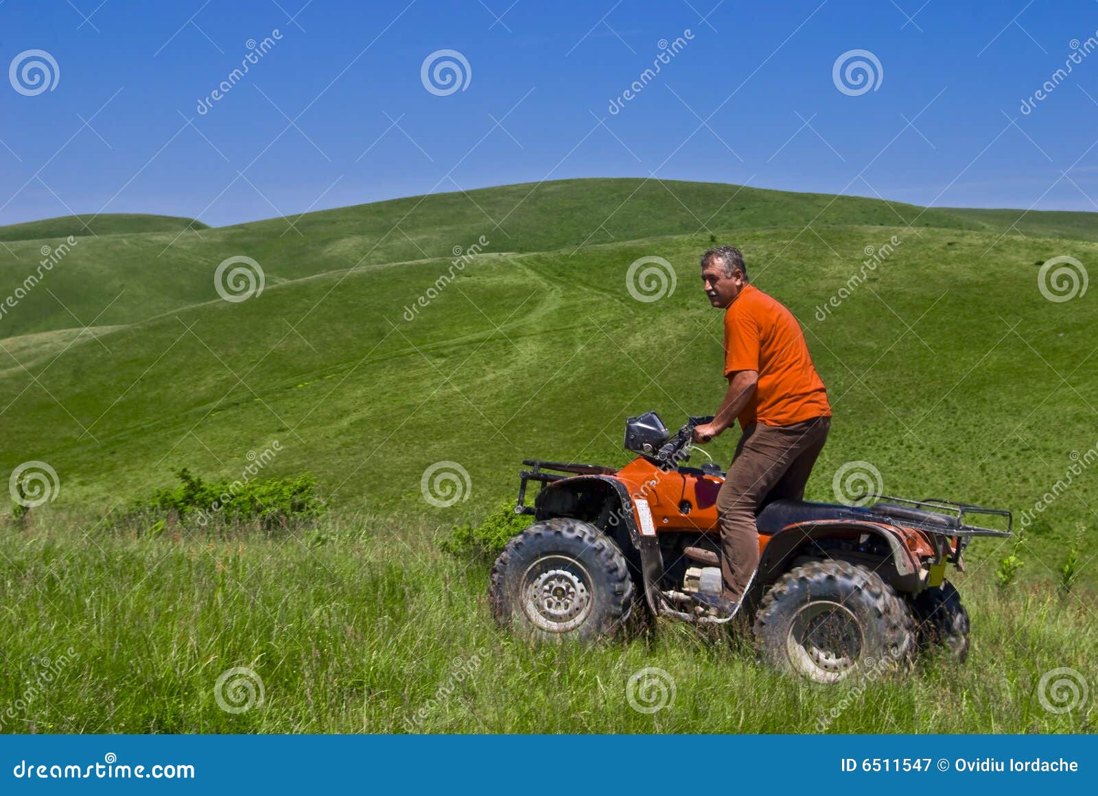 Atv riding on hills - quad stock image. Image of sports - 6511547