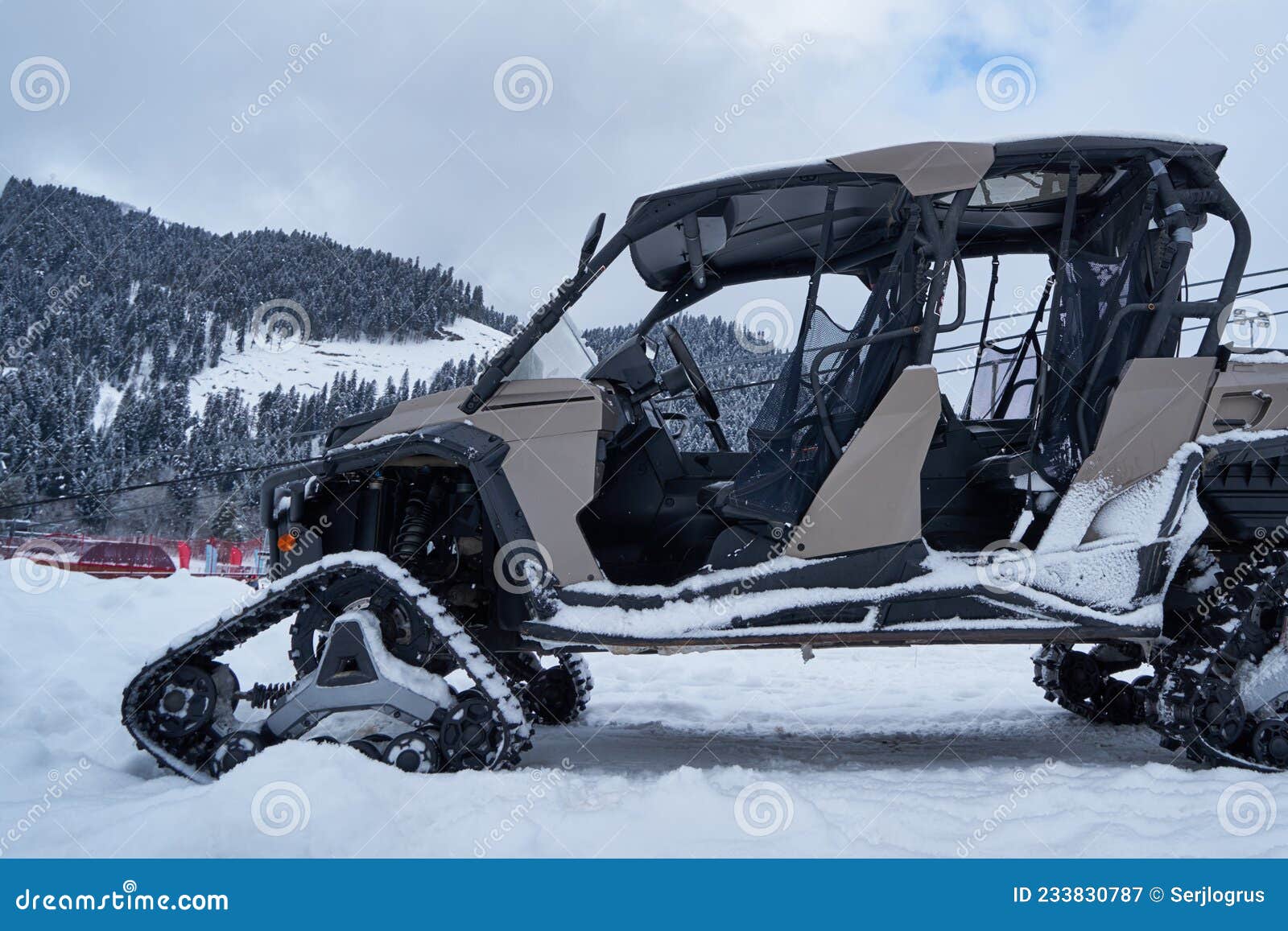 ATV with a tracked system stock image. Image of road - 233830787