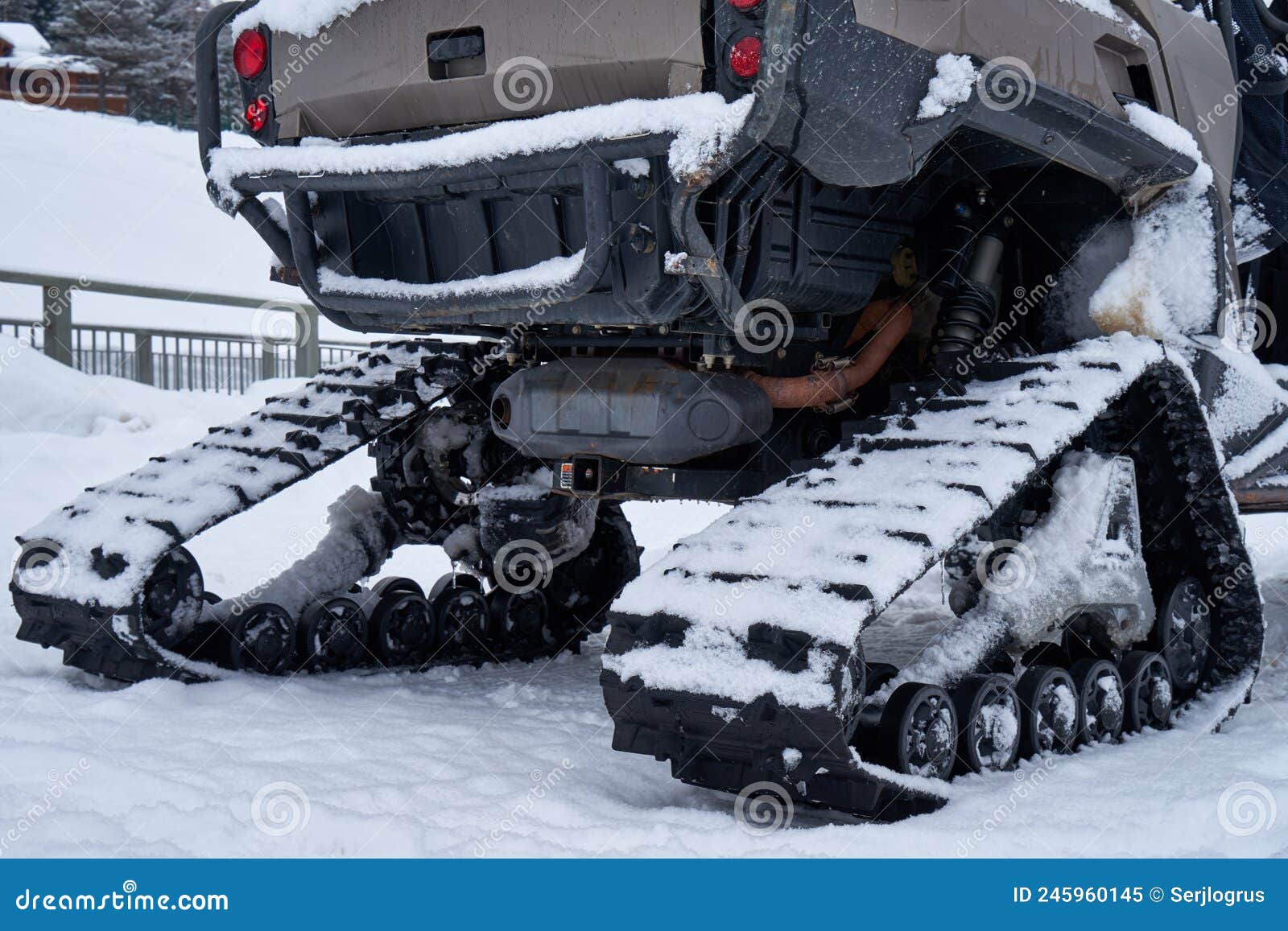 ATV with a tracked system stock image. Image of snowfall - 245960145