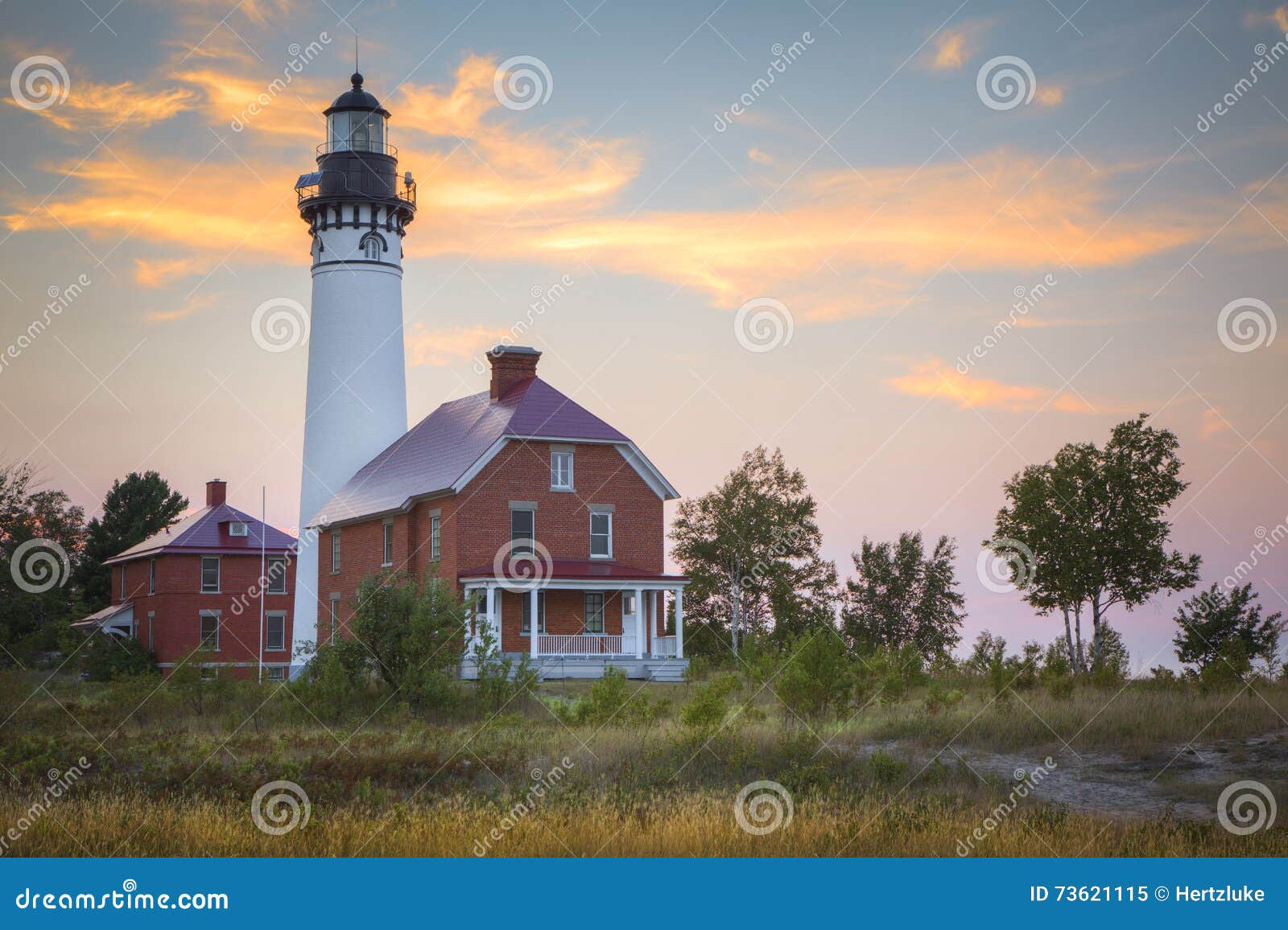 Au Sable Lighthouse stock image. Image of grass, rocks - 73621115