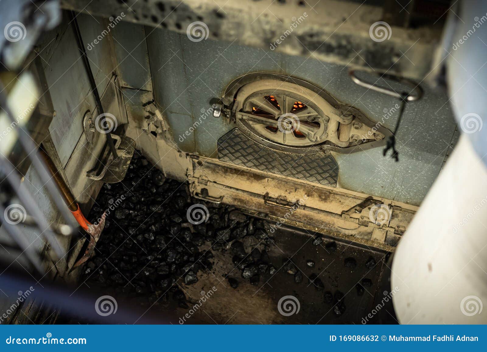A Worker Insert a Coal Inside the Engine of Coaled Power Steam Ship ...