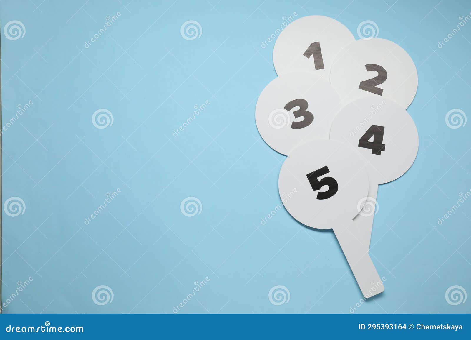 Auction Paddles with Numbers on Light Blue Background, Top View. Space ...