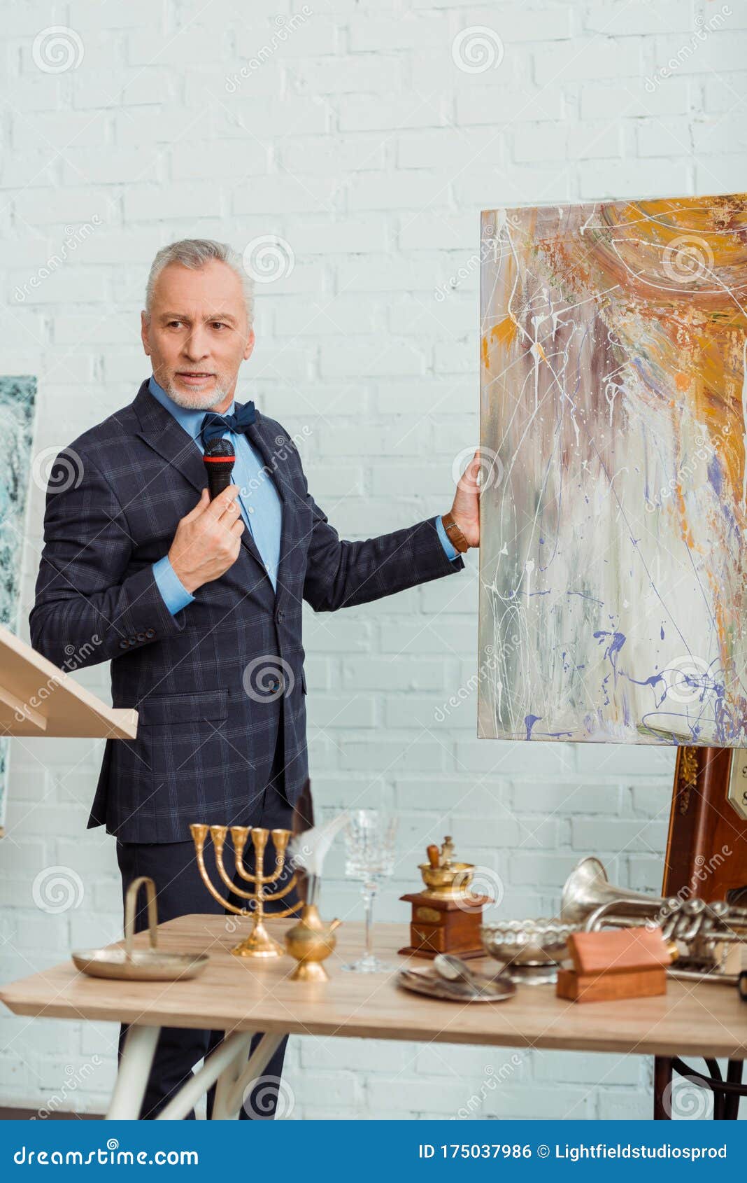 Auctioneer Talking with Microphone and Holding Stock Photo - Image of ...