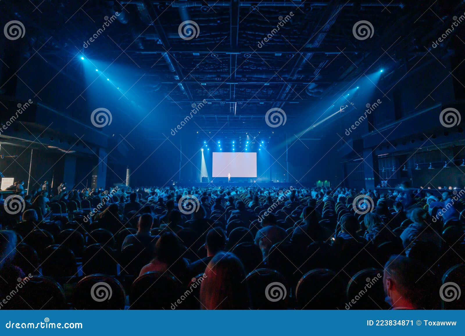 Audience Sitting in Front of Stage with Screen Editorial Photo - Image ...