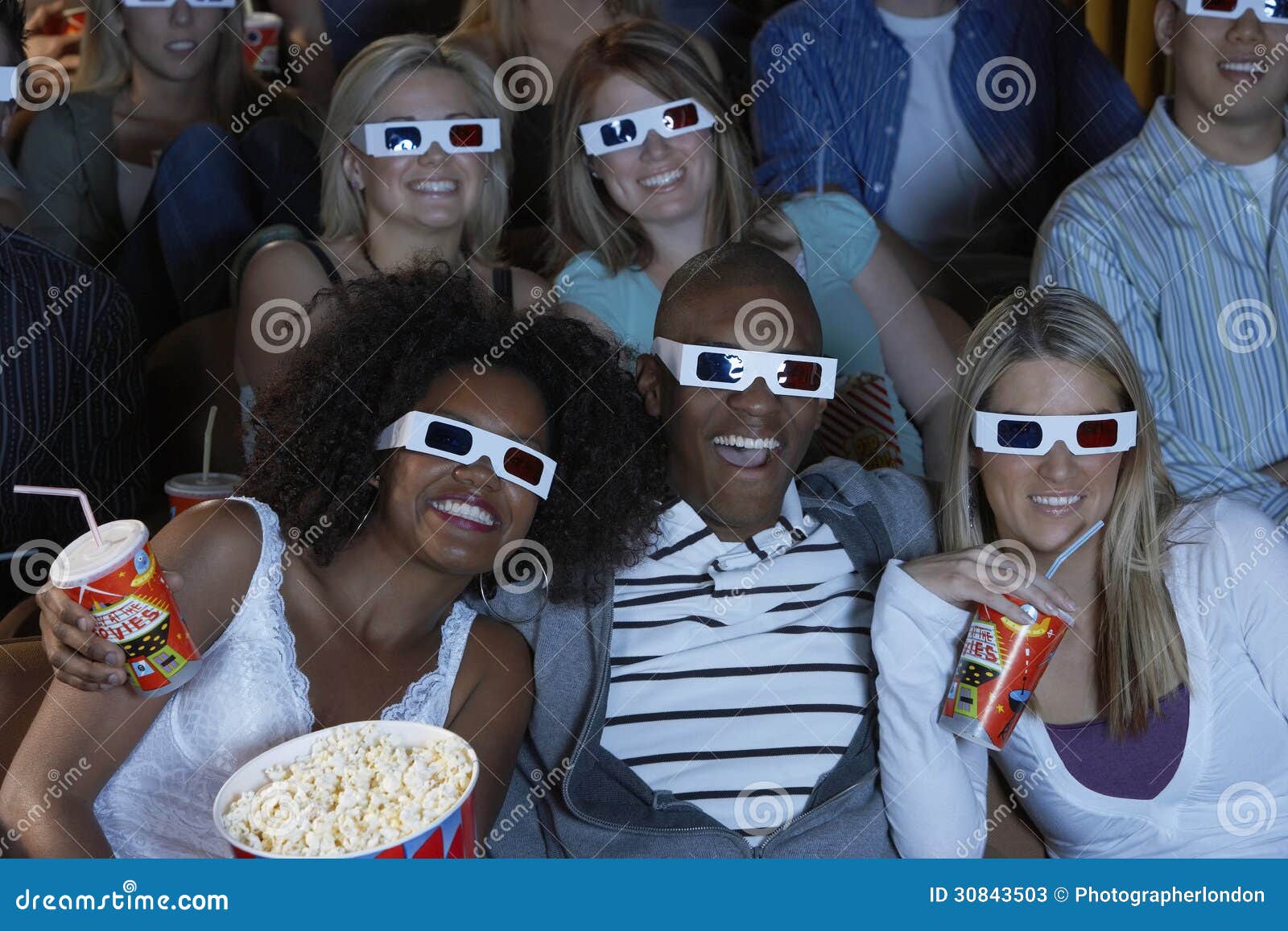 Audience Watching A Movie In A Cinema With A Glowing Screen, Immersive ...
