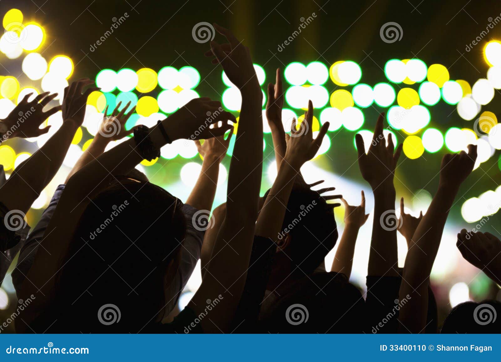 Audience Watching a Rock Show, Hands in the Air, Rear View, Stage ...