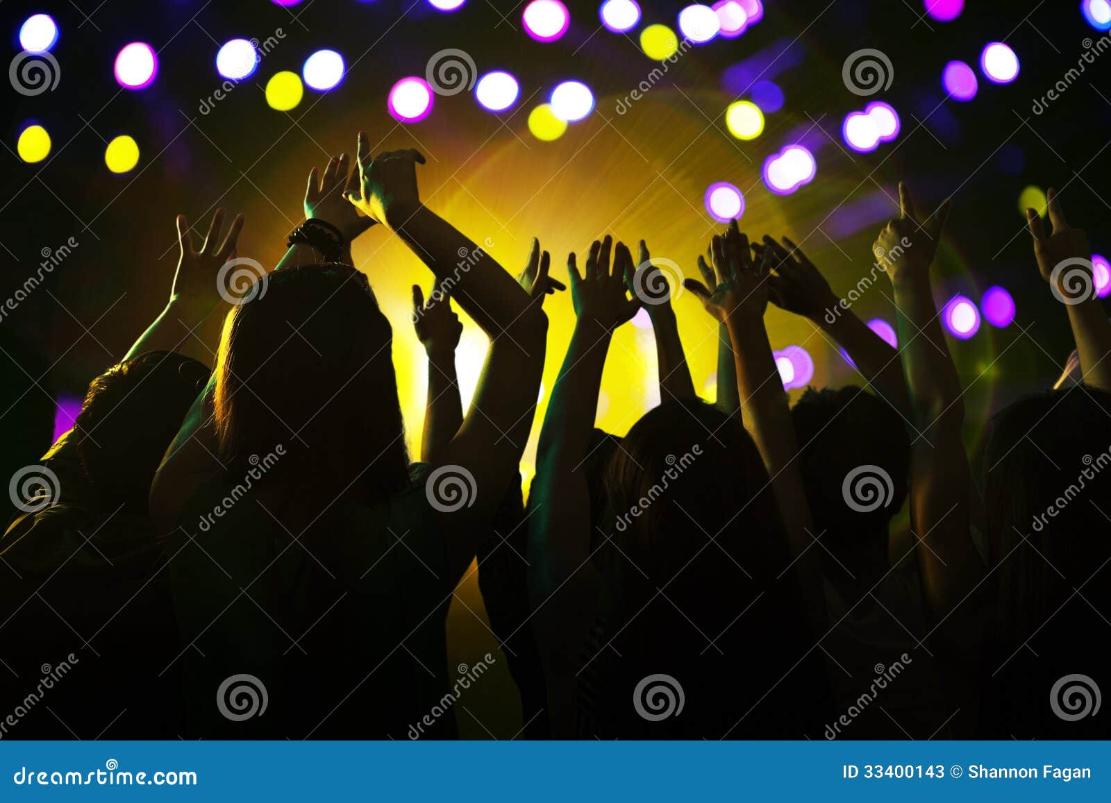 Audience Watching a Rock Show, Hands in the Air, Rear View, Stage ...