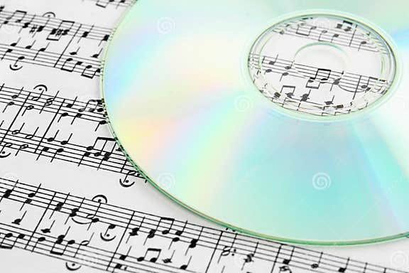 Audio CD and music notes stock image. Image of record - 4386417