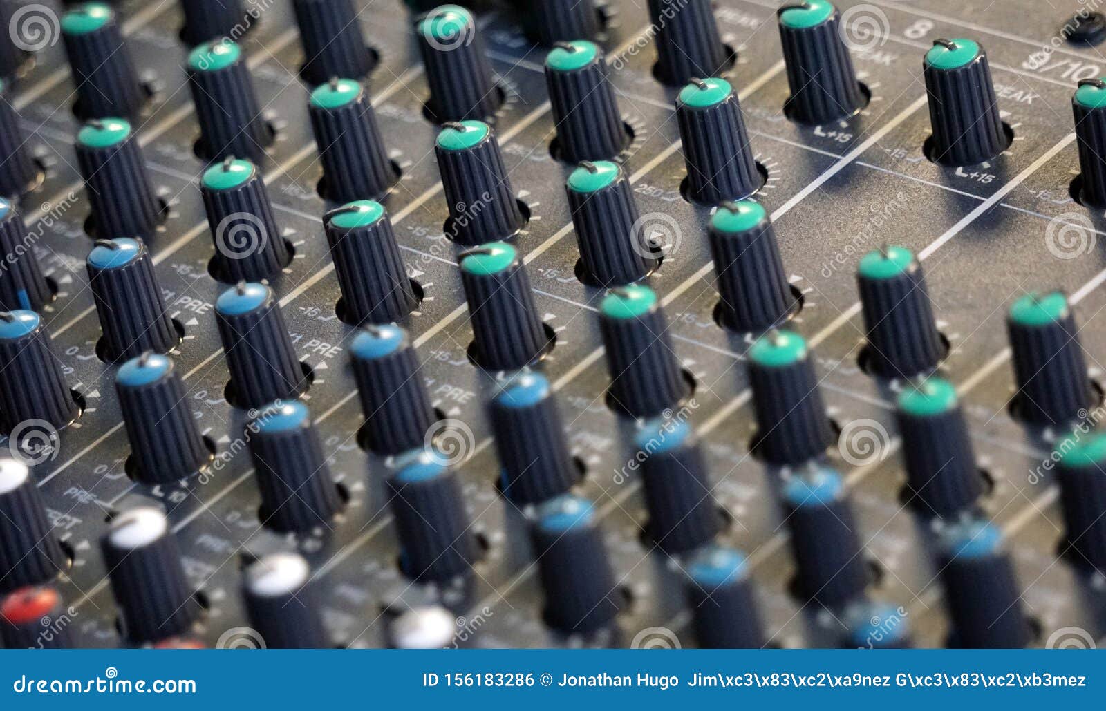 Audio console knobs stock photo. Image of metallic, green - 156183286