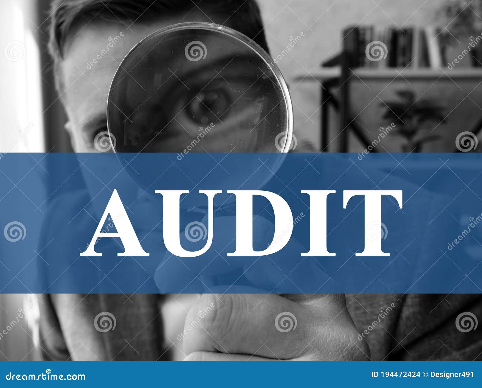Audit Concept. Auditor with a Magnifying Glass in Office. Stock Photo ...