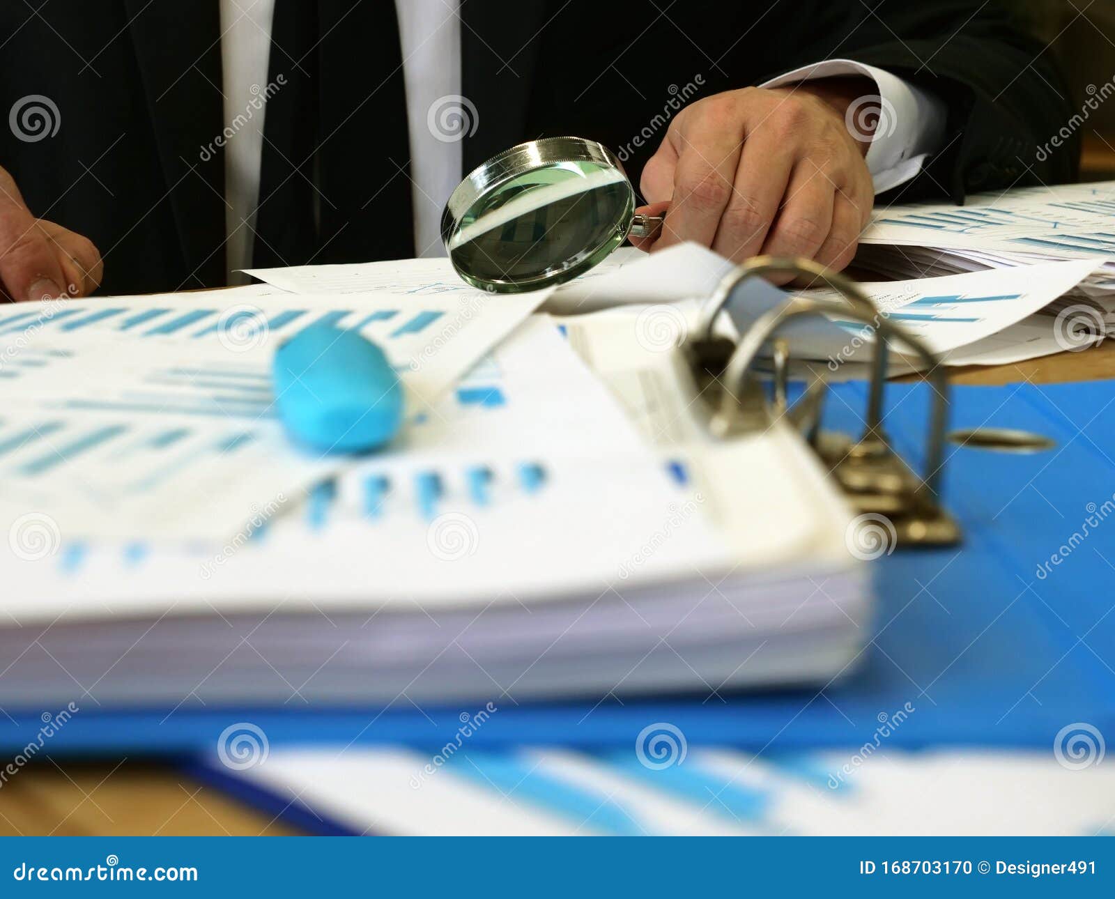 Audit Concept. Man Sits at a Table and Checks Documents. Stack of ...