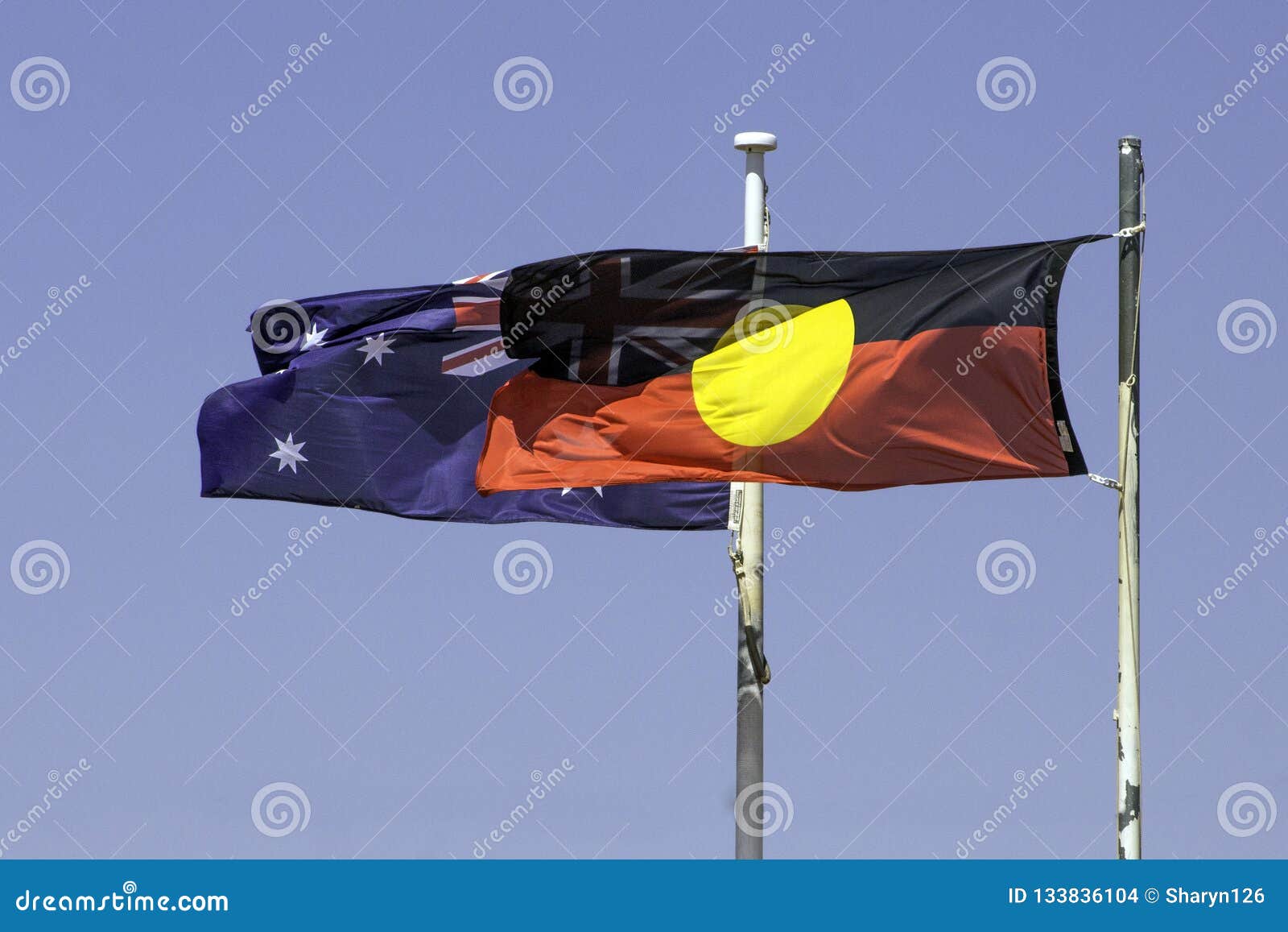 Australian and Aboriginal Flags Flying Together with Union Jack Stock ...