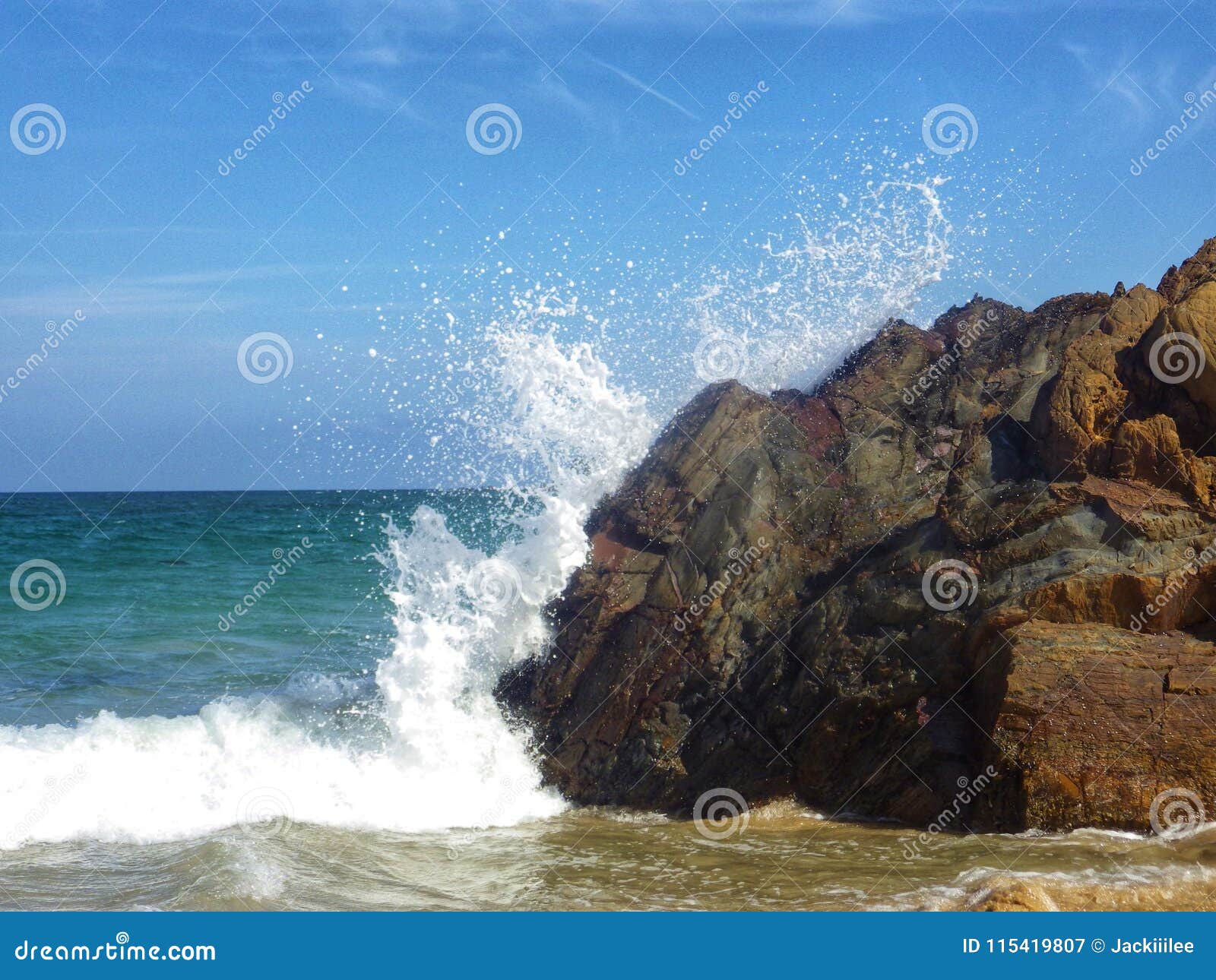Wave crashing over rock stock image. Image of wave, scene - 115419807