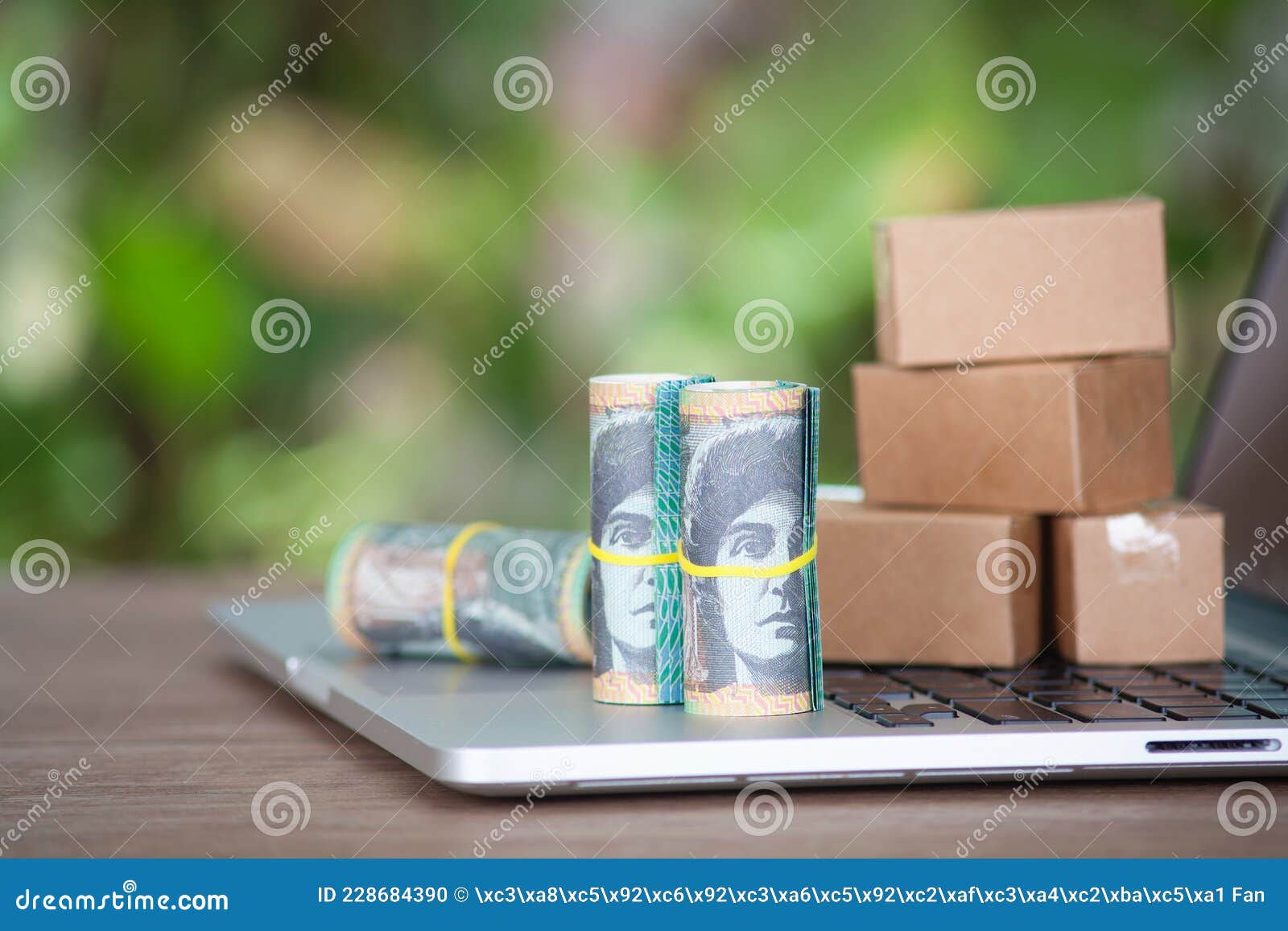 Australian Dollar Banknotes and Courier Box Model on Laptop Keyboard ...