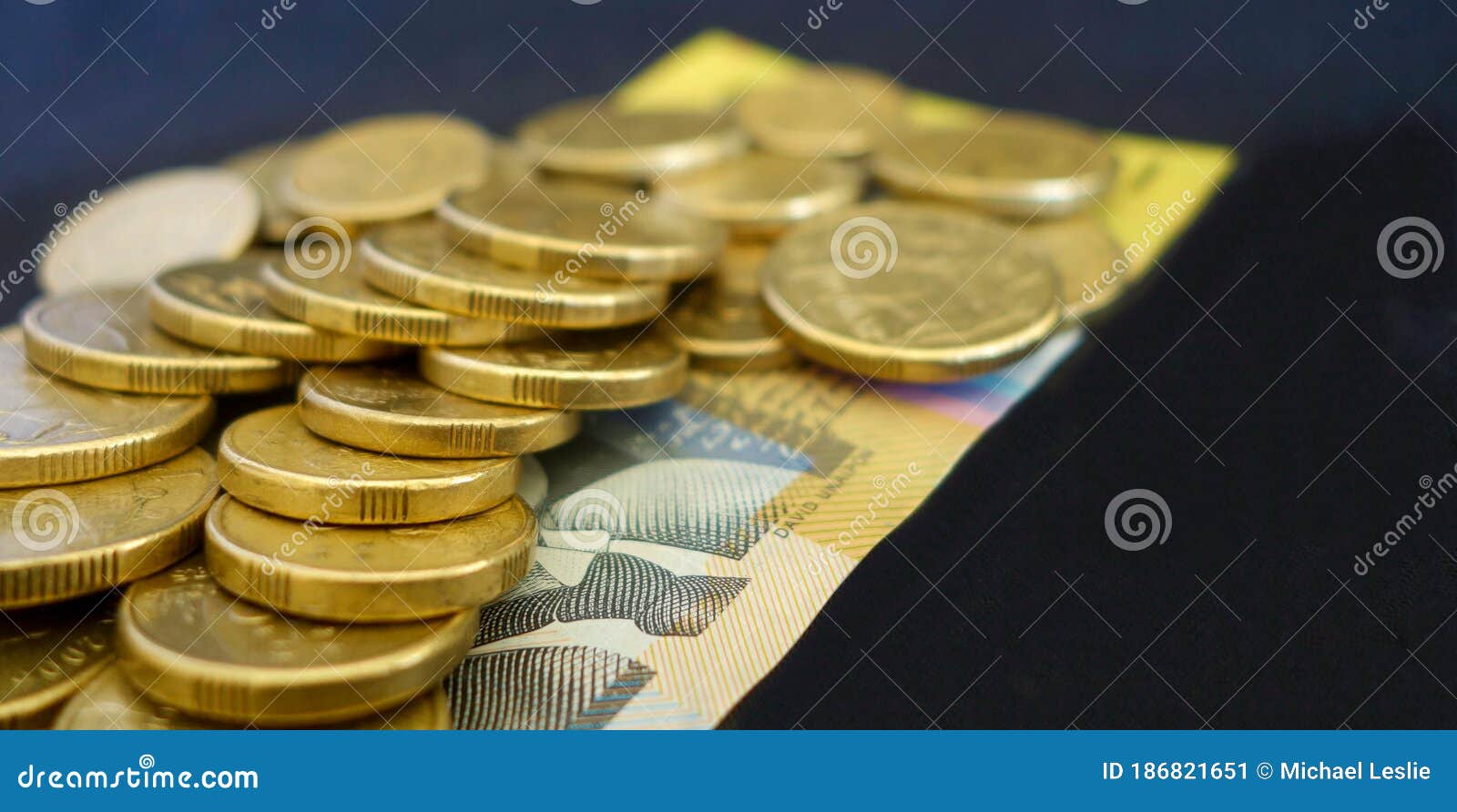 Australian Fifty Dollar Notes Supporting a Fallen Stack of One and Two ...