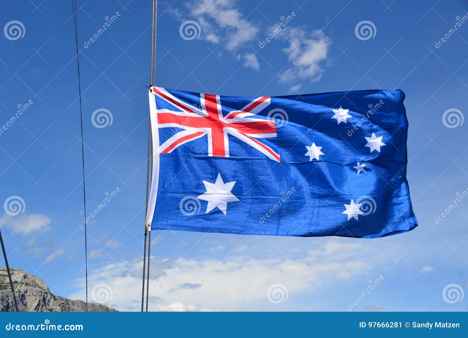 Australian Flag on Blue Sky Stock Image - Image of flying, blowing ...