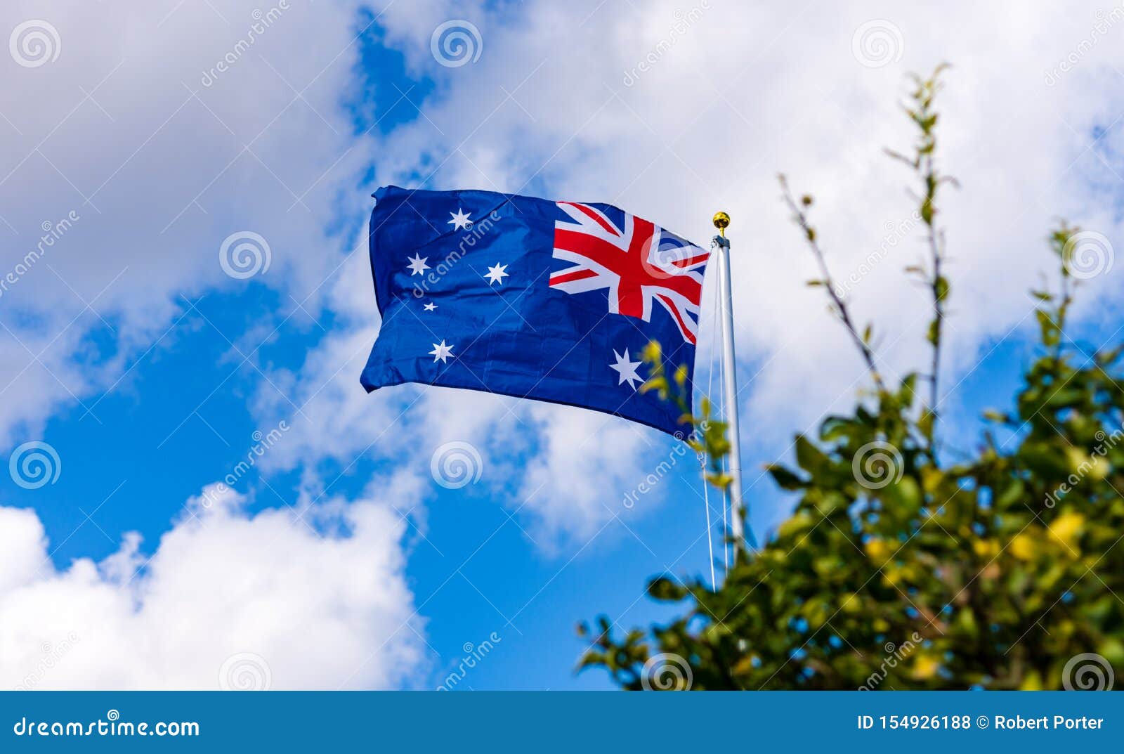 Australian Flag Flying in the Wind Stock Photo - Image of trees ...