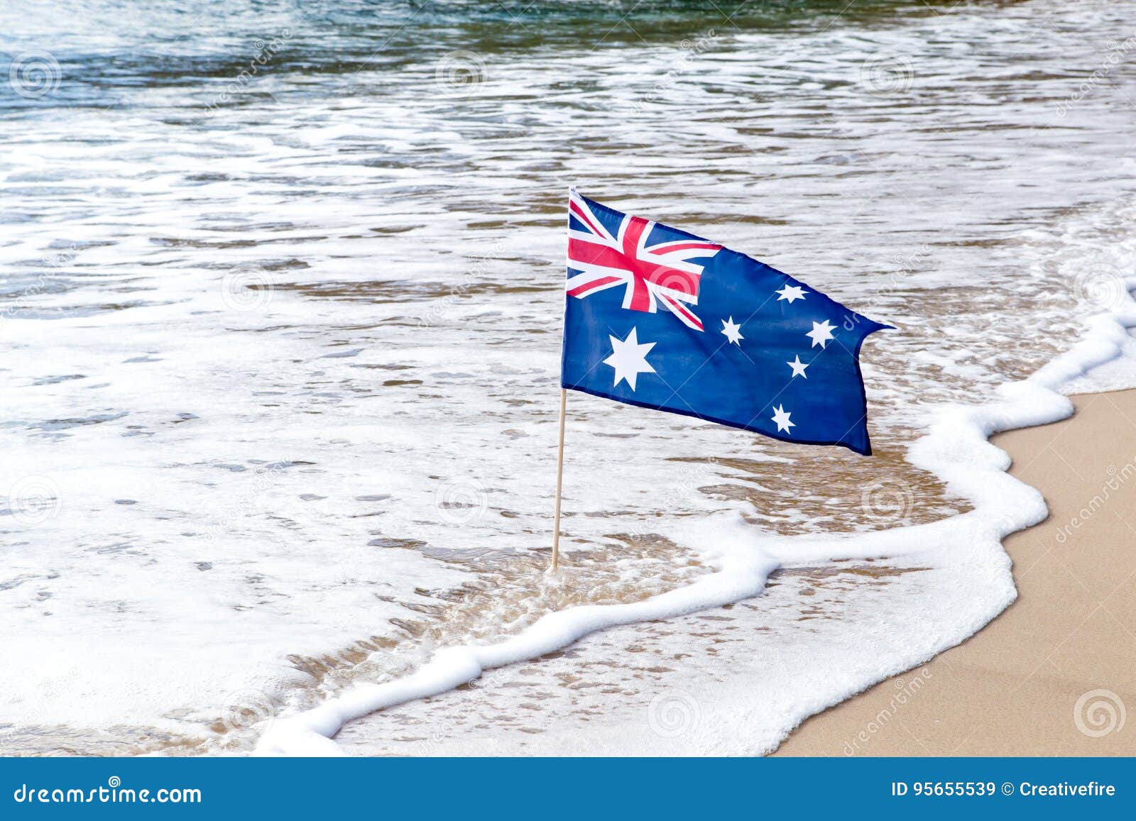 Australian Flag Waving in the Wind on the Beach Stock Image - Image of ...