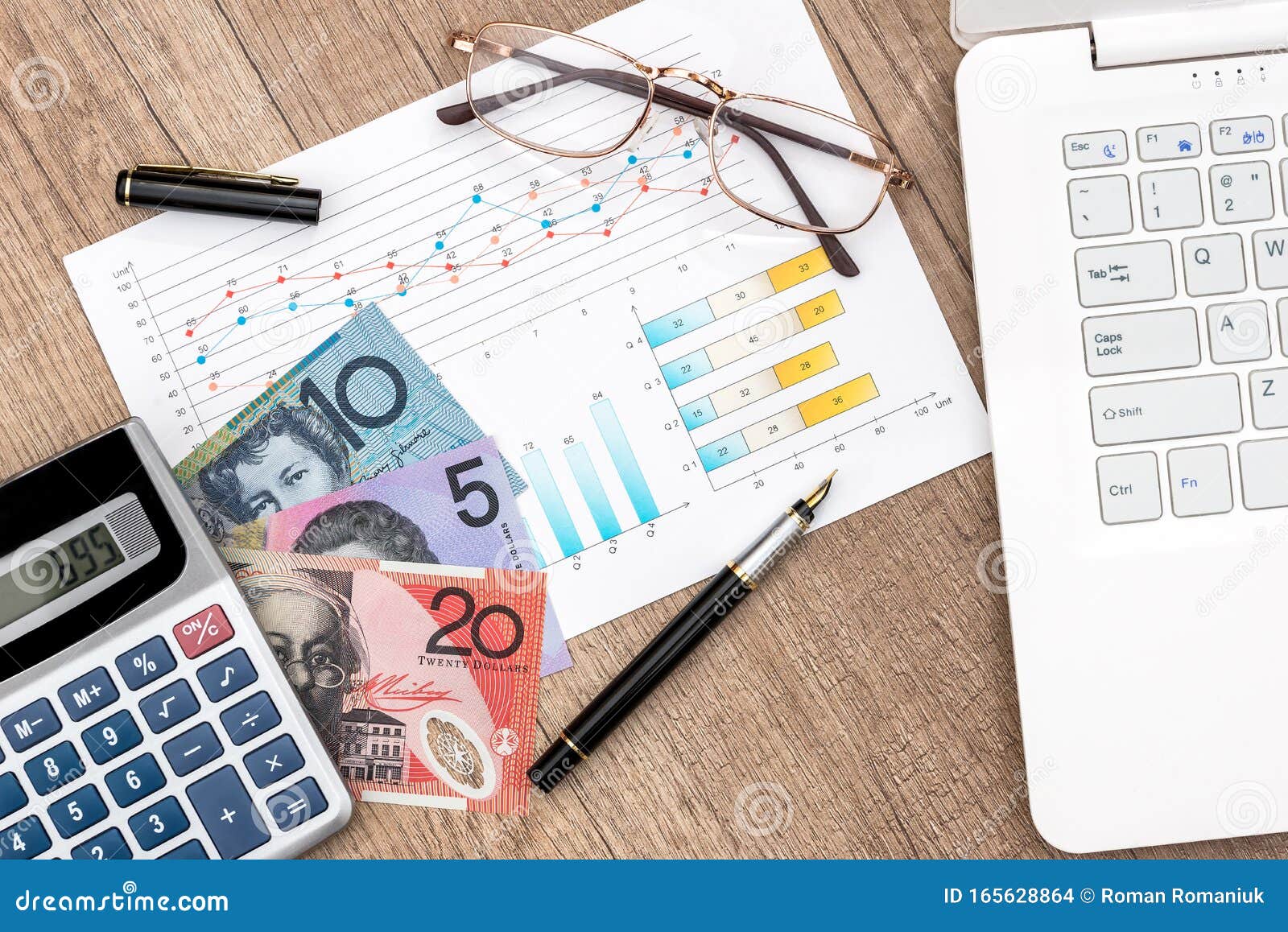 Australian Money with a Laptop Calculator and a Chart on the Table ...