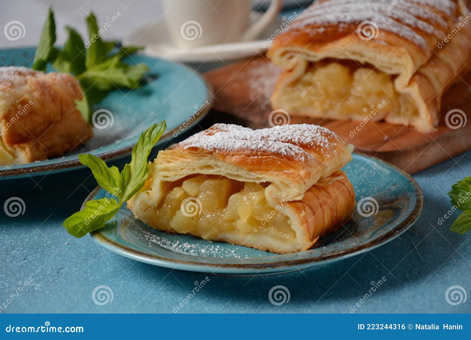 Austrian Strudel with Mint and with Powdered Sugar on a Plate. Stock ...