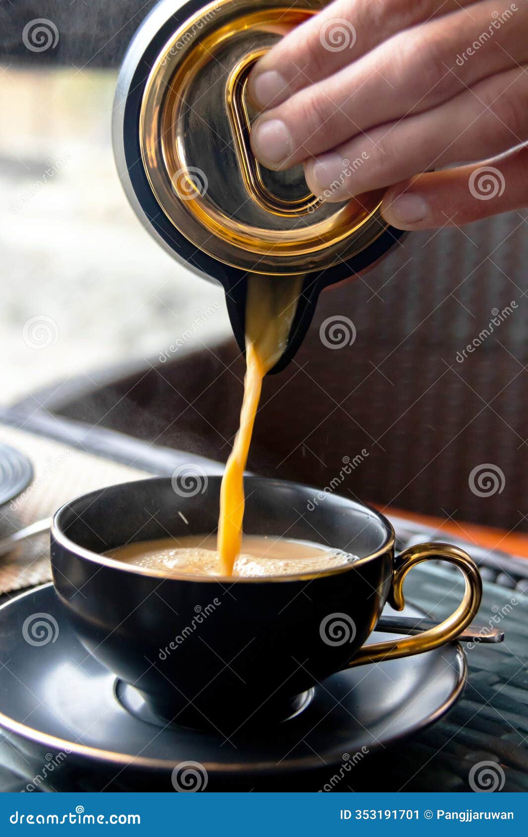 Authentic Pakistani Rich Chai Tea a Pouring into a Stylish Cup Stock ...