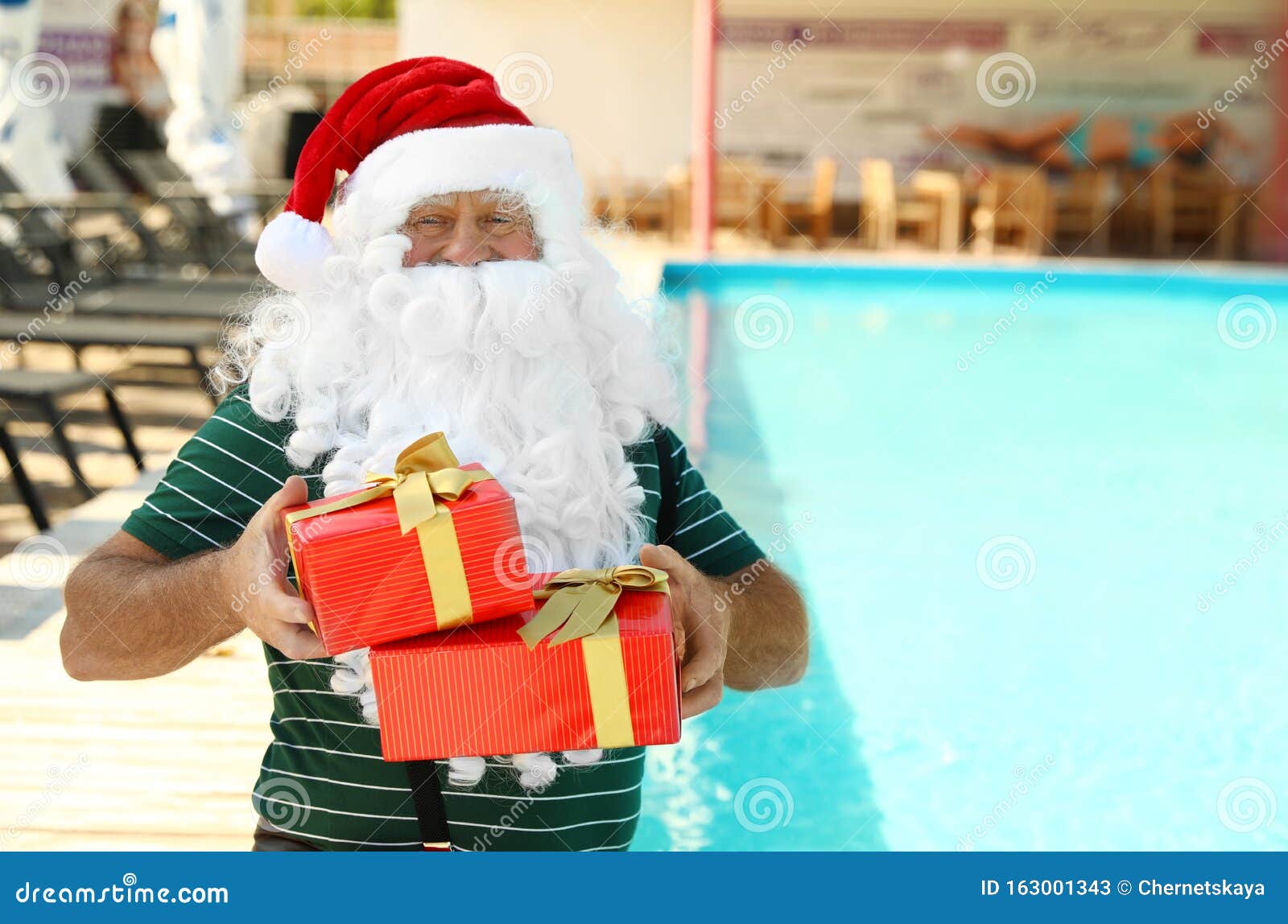 Authentic Santa Claus with Gift Boxes Near Pool Stock Image - Image of ...