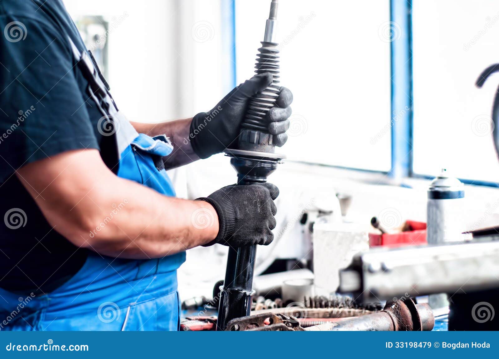 Auto Car Mechanic Adjusting a Car Shock Absorber Stock Image - Image of ...