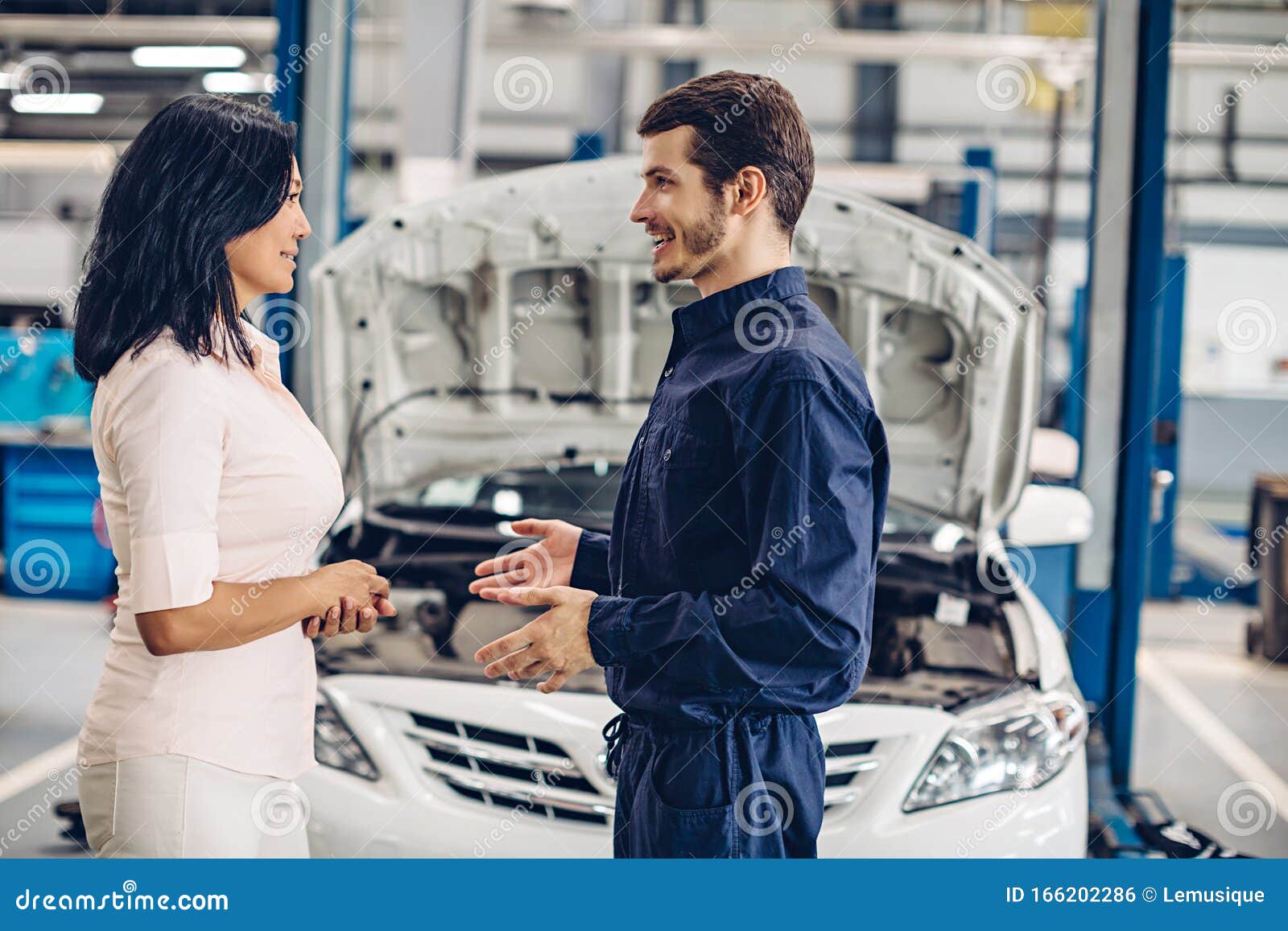 Auto Car Repair Service Center. the Mechanic Communicates with the ...