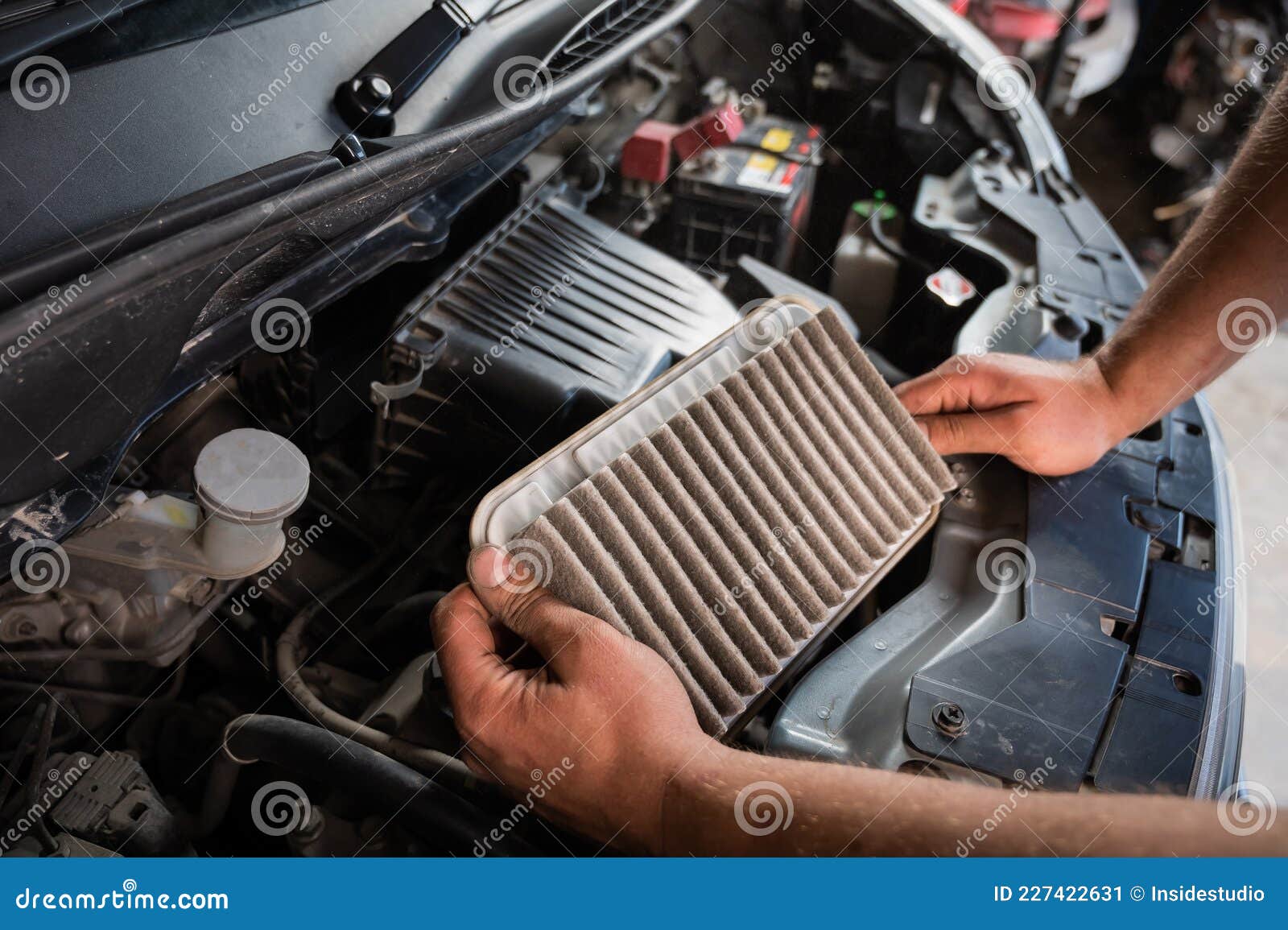 An Auto Mechanic is Changing the Air Filter in the Car Stock Image ...