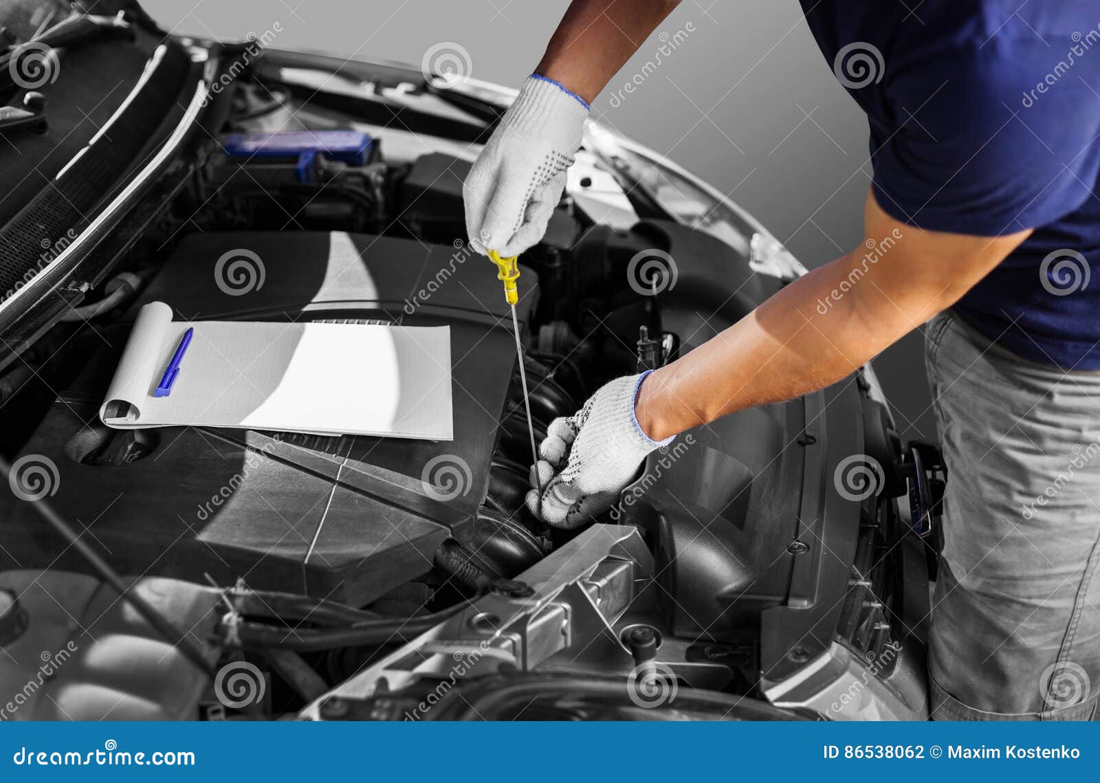 Auto Mechanic Checking the Oil Level in Car Engine Stock Photo - Image ...
