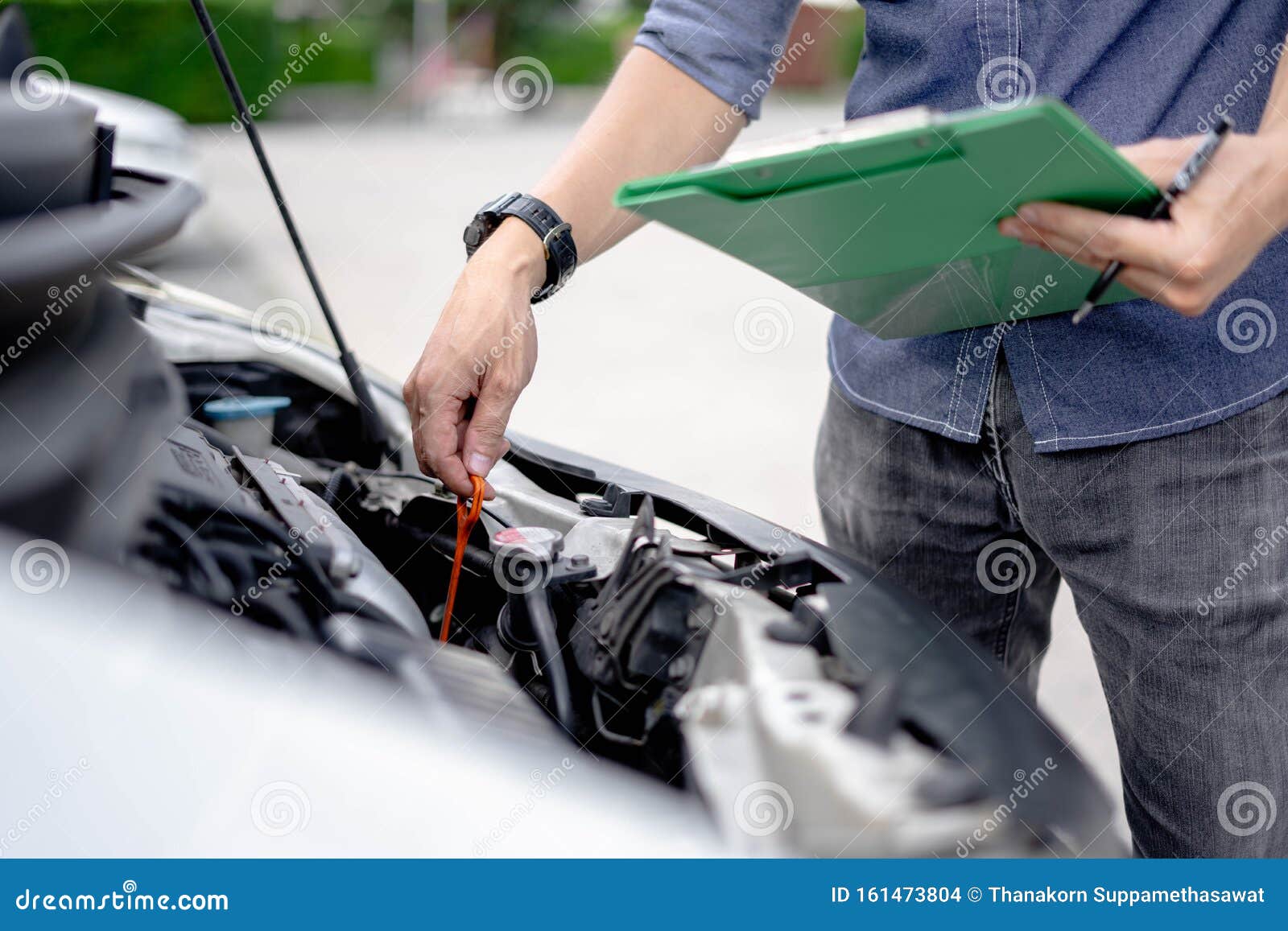 Auto Mechanic Checking the Oil Level in Car Engine, Check and ...