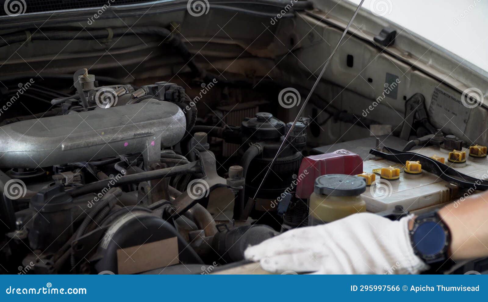 Auto Mechanic Checking the Oil Level in Car Engine.inspects Engine ...