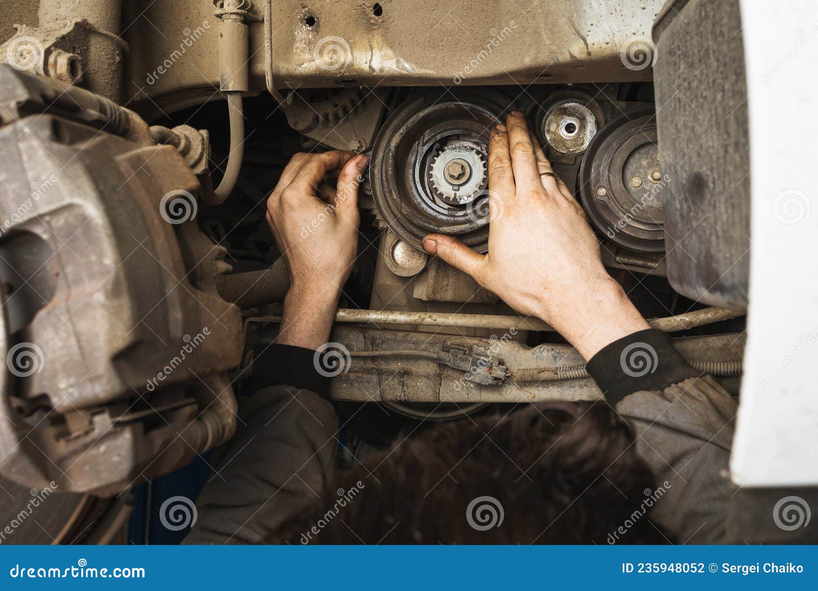 An Auto Mechanic Disassembles a Passenger Car Generator Stock Photo ...