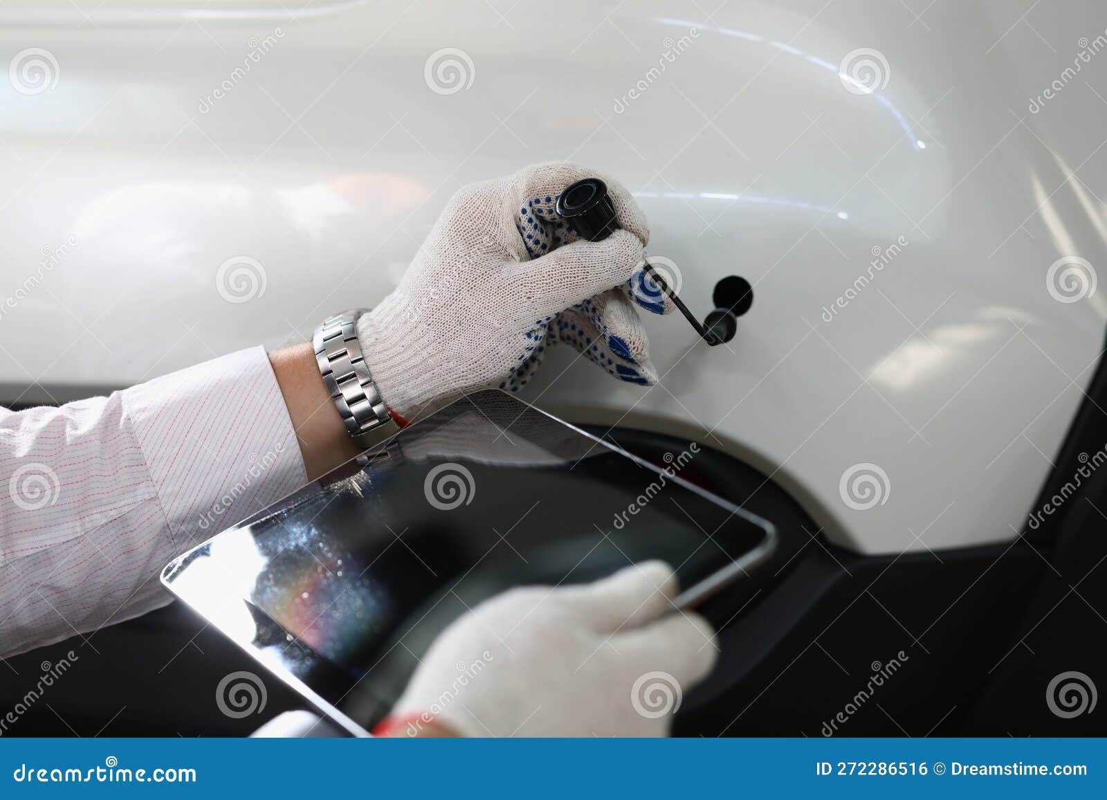 Auto Mechanic Holds Tablet and Car Tube on White Auto Stock Photo ...